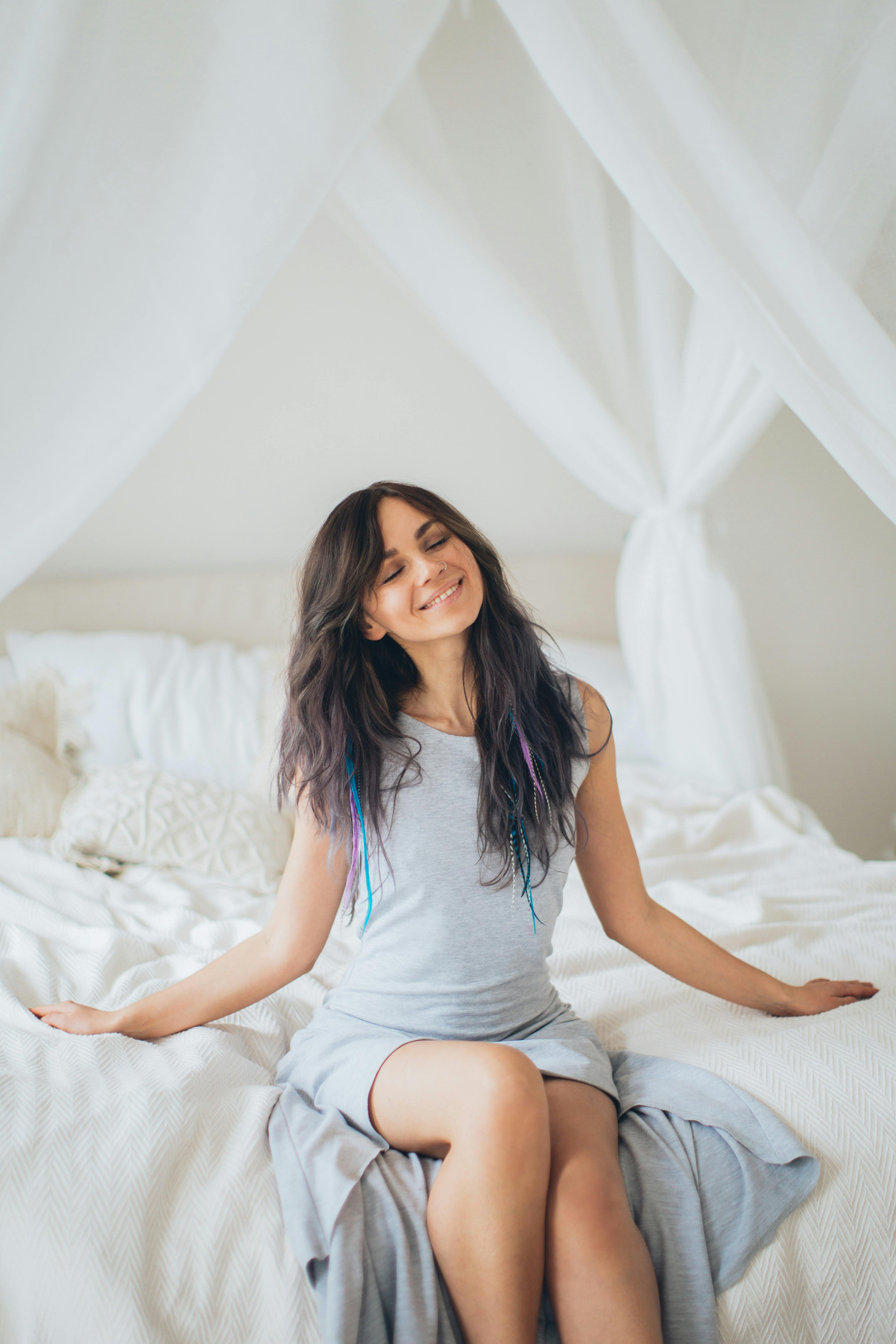 Woman Standing on Bed · Free Stock Photo
