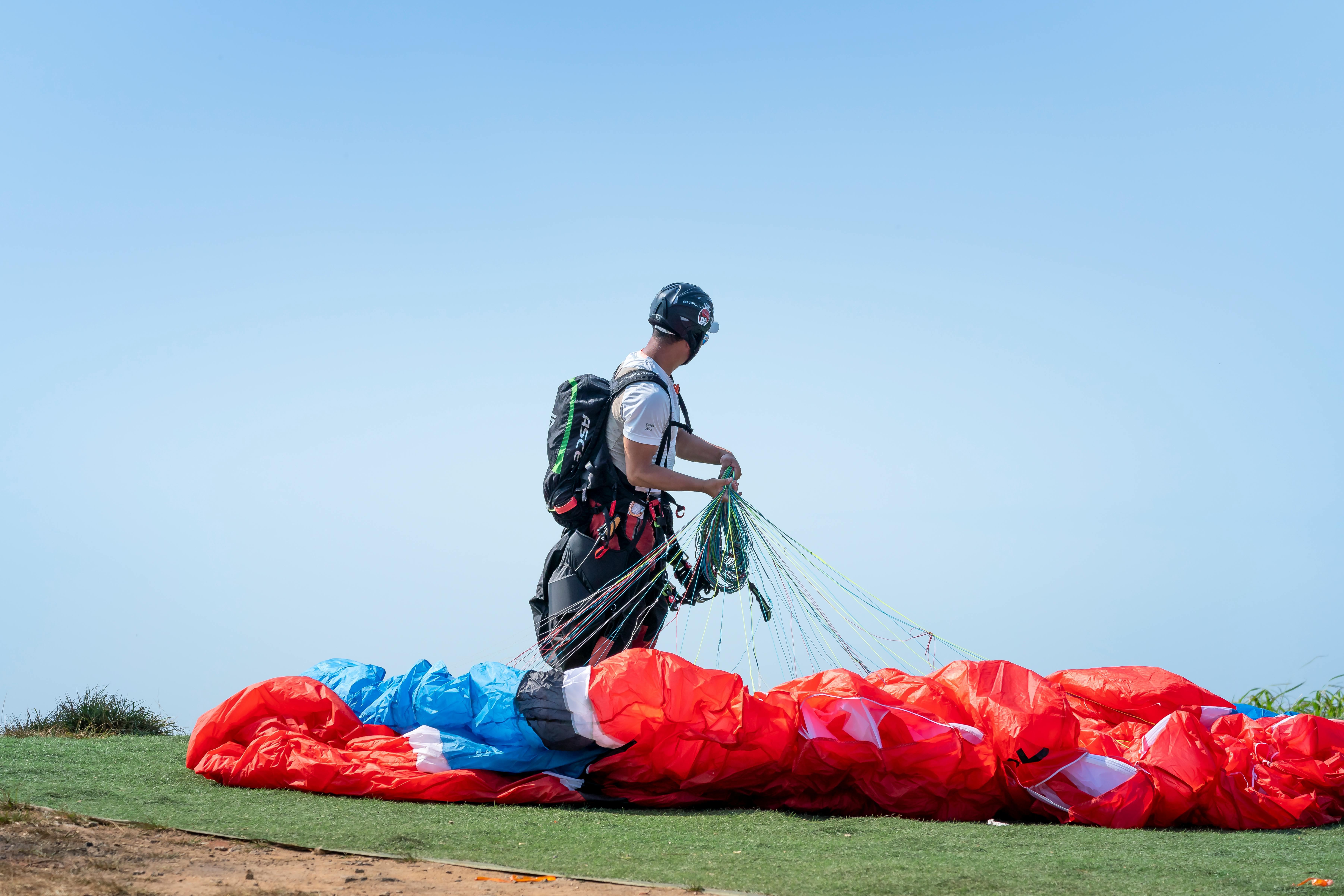 Photo Of Person Holding Parachute · Free Stock Photo