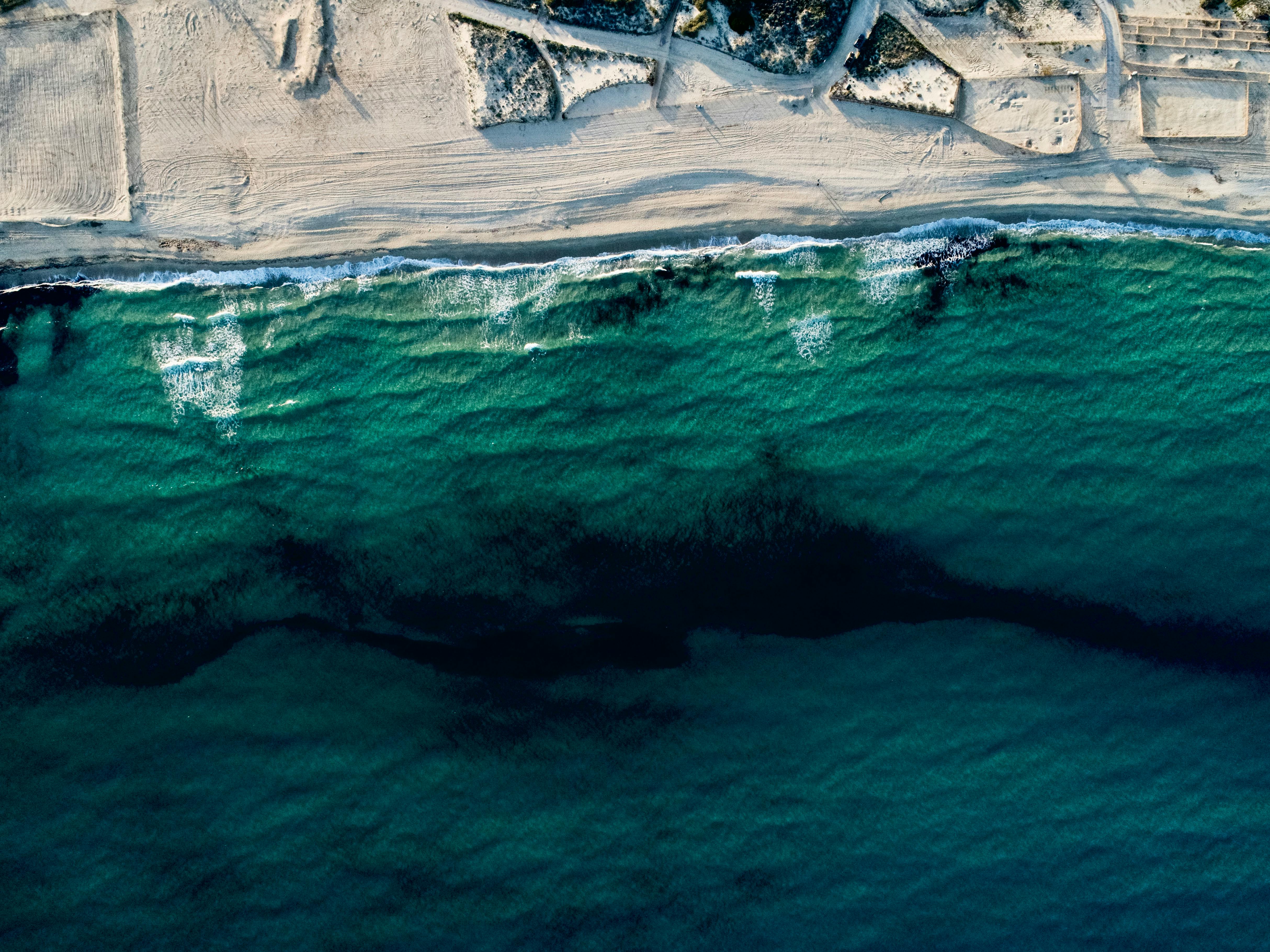 Ocean Near Sand · Free Stock Photo
