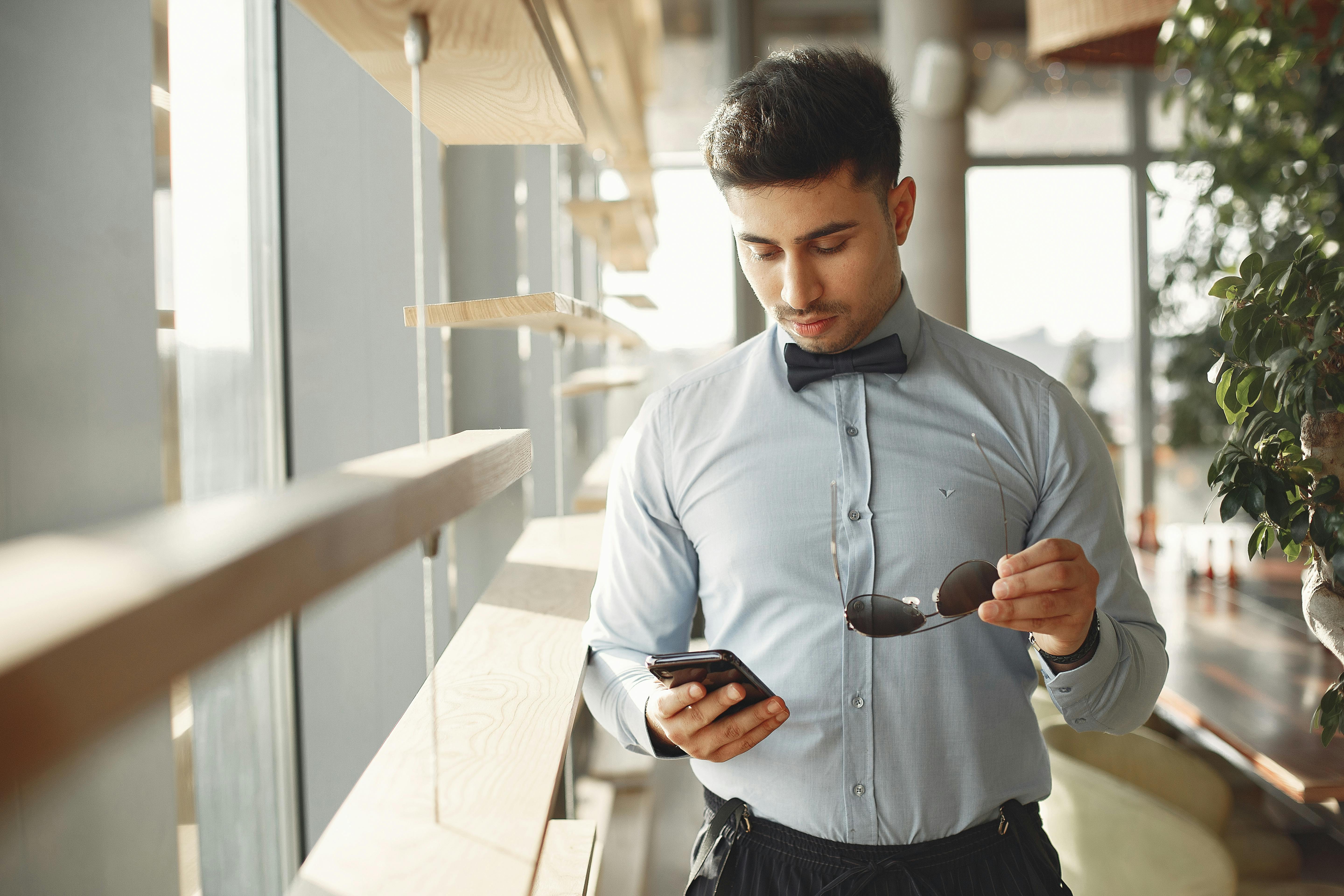 Man Holding Black Smartphone · Free Stock Photo
