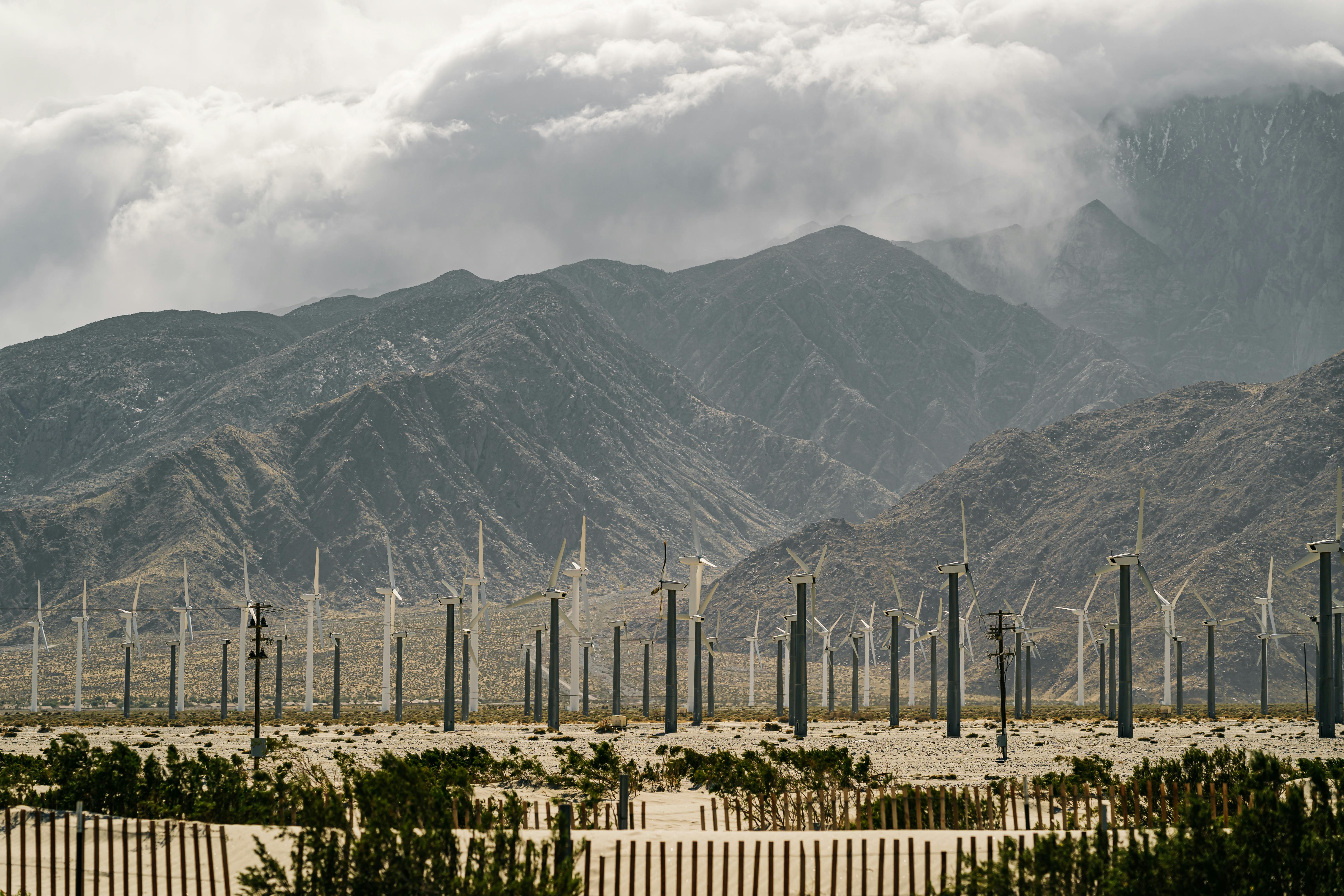 Wind Turbines Near Mountain · Free Stock Photo