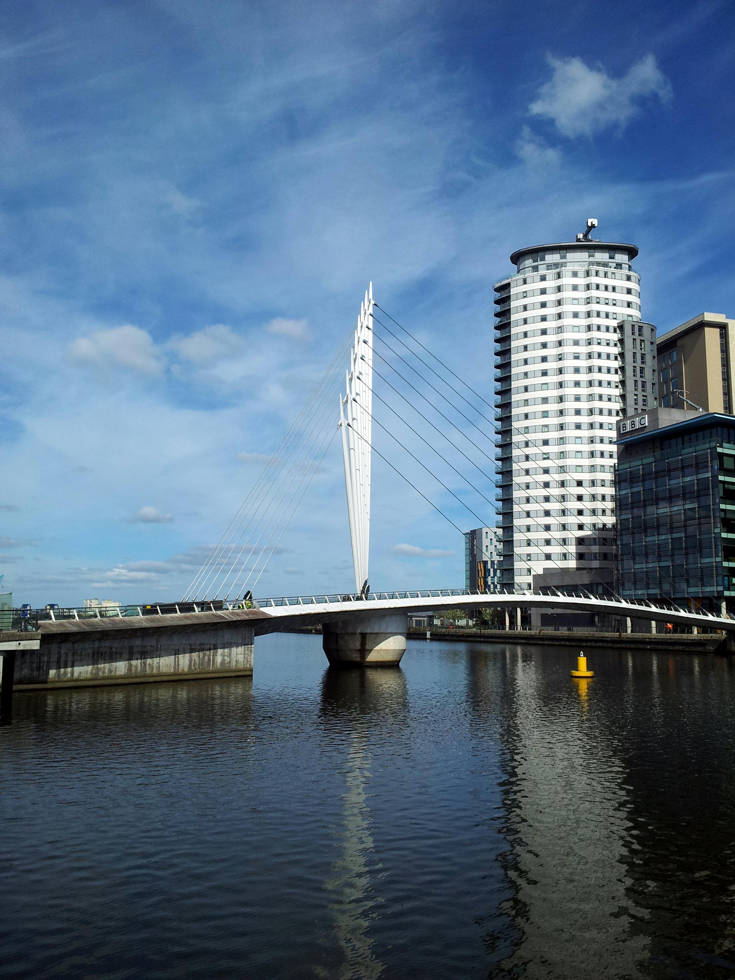 Reflection of Yellow High Rise Tower during Night Time · Free Stock Photo