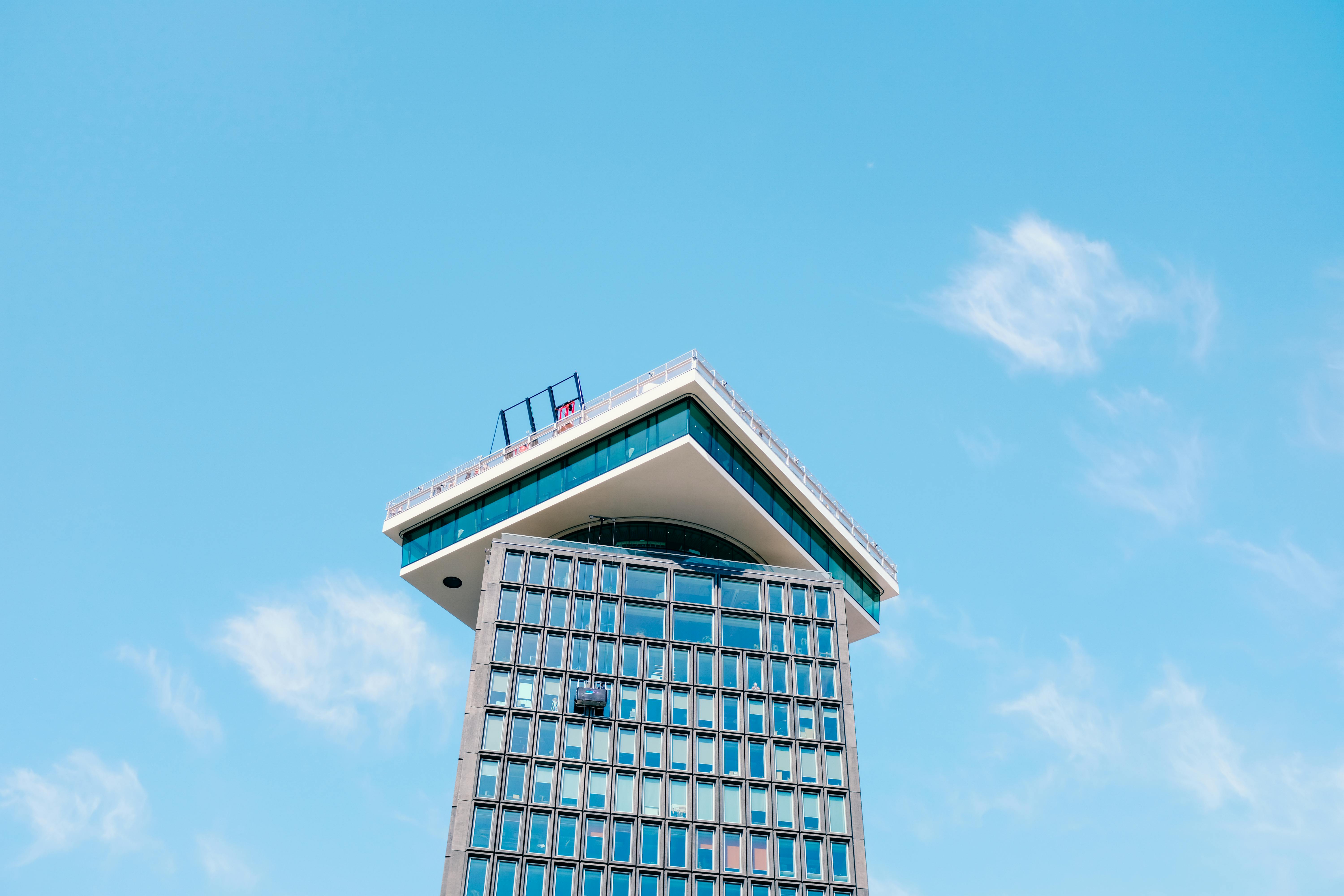 Blue and White Concrete Building Under Blue Sky · Free Stock Photo
