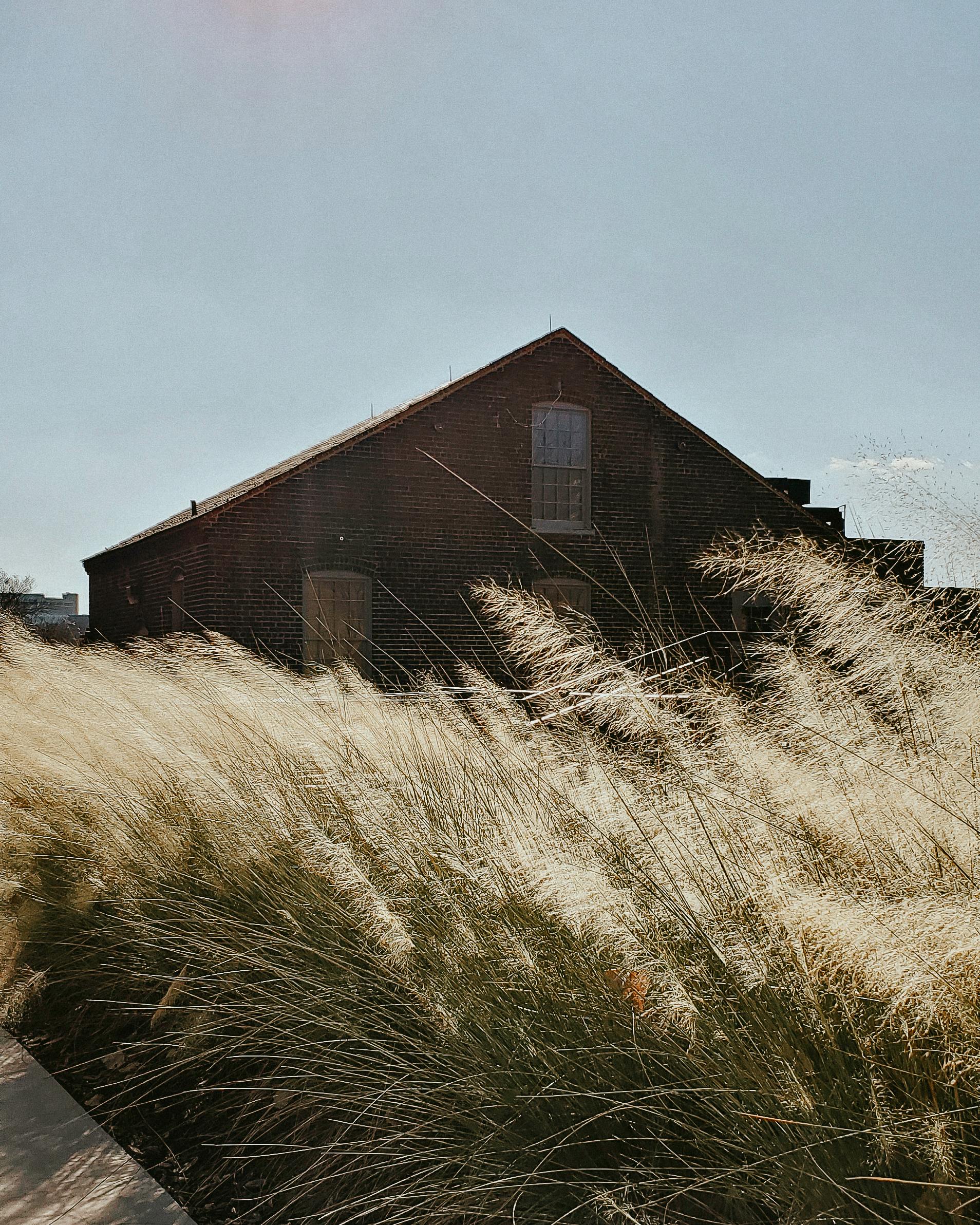 A Brick House on the Grass Field · Free Stock Photo