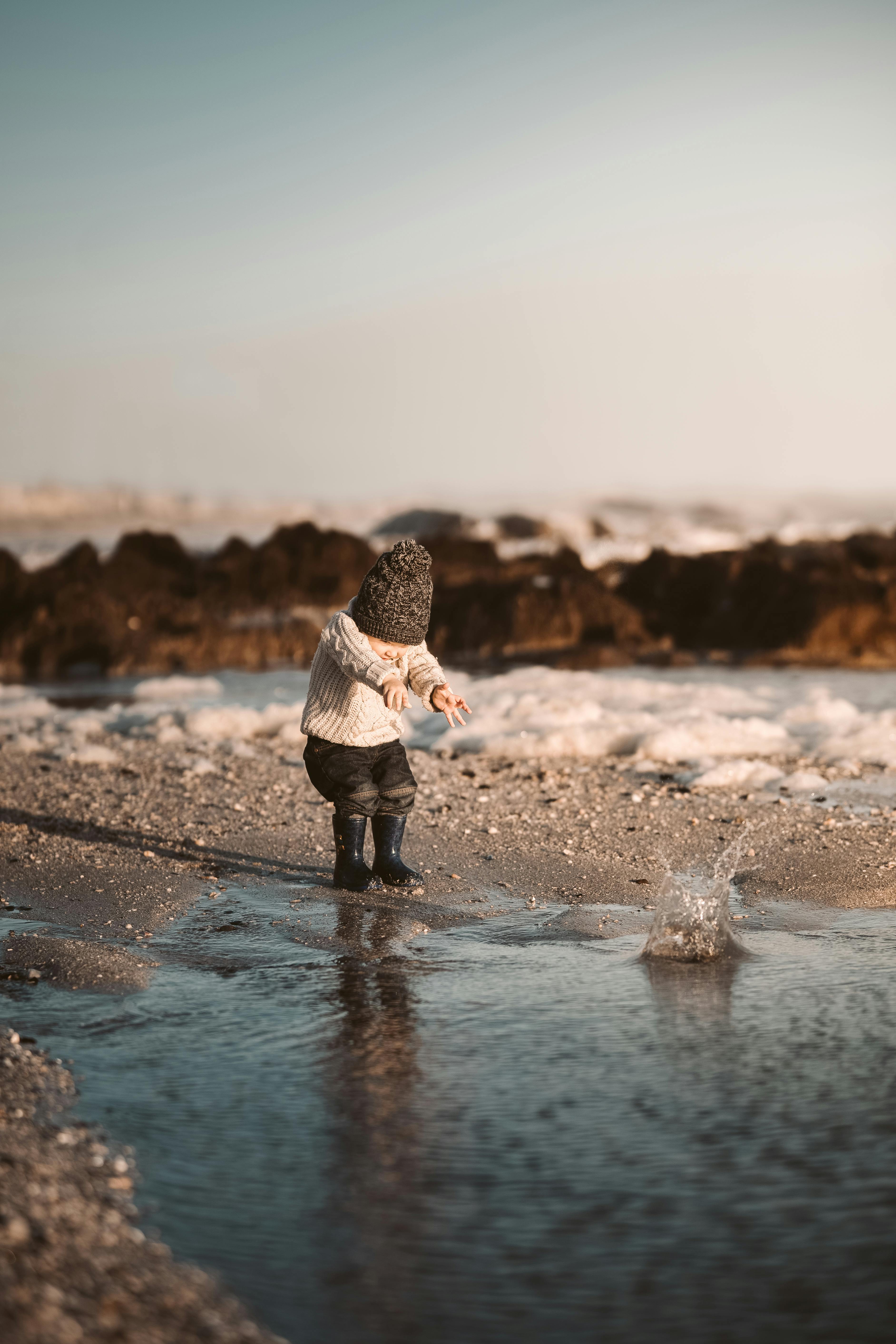 Photo Of Toddler Near Water · Free Stock Photo