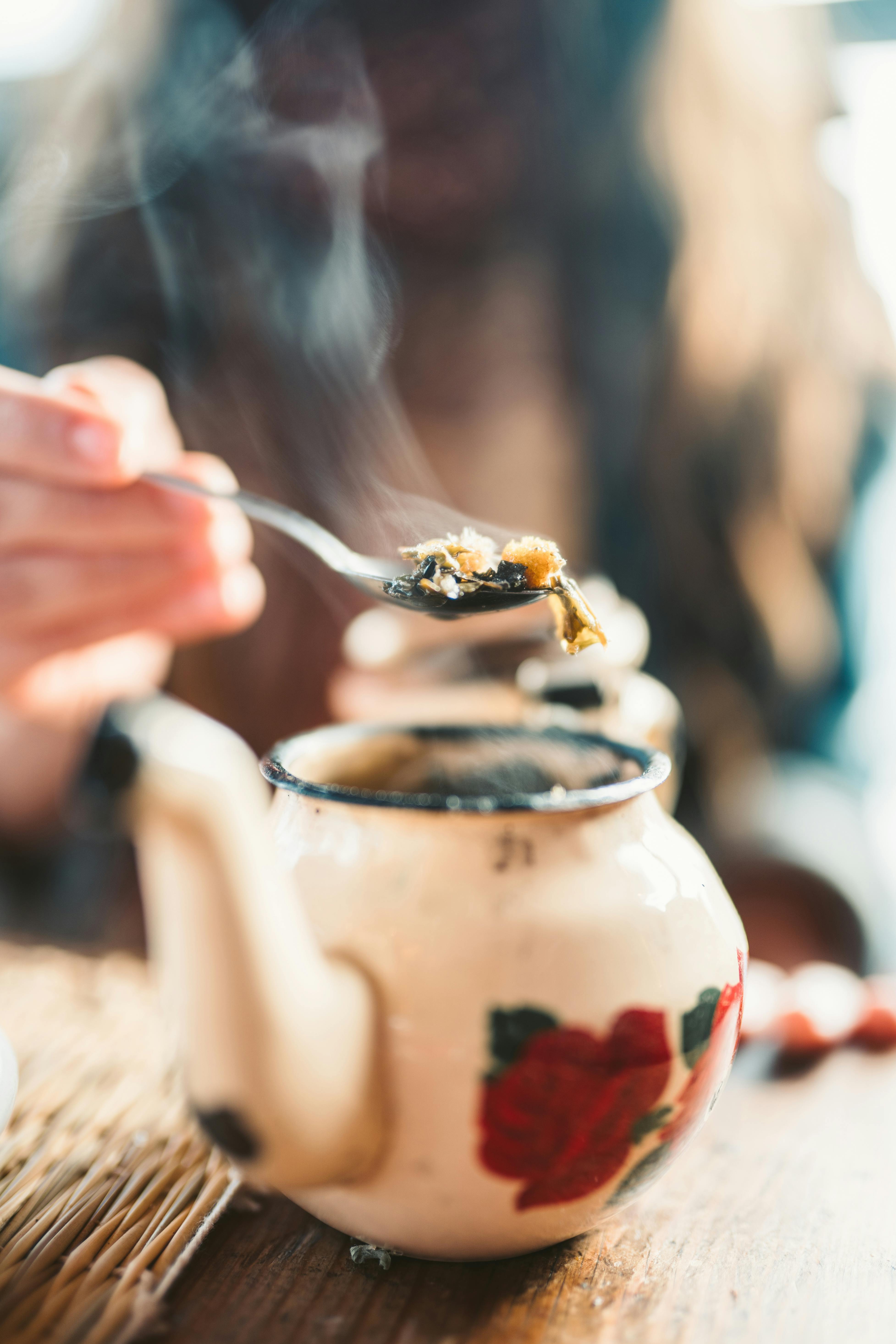 A Person Holding a Spoon · Free Stock Photo