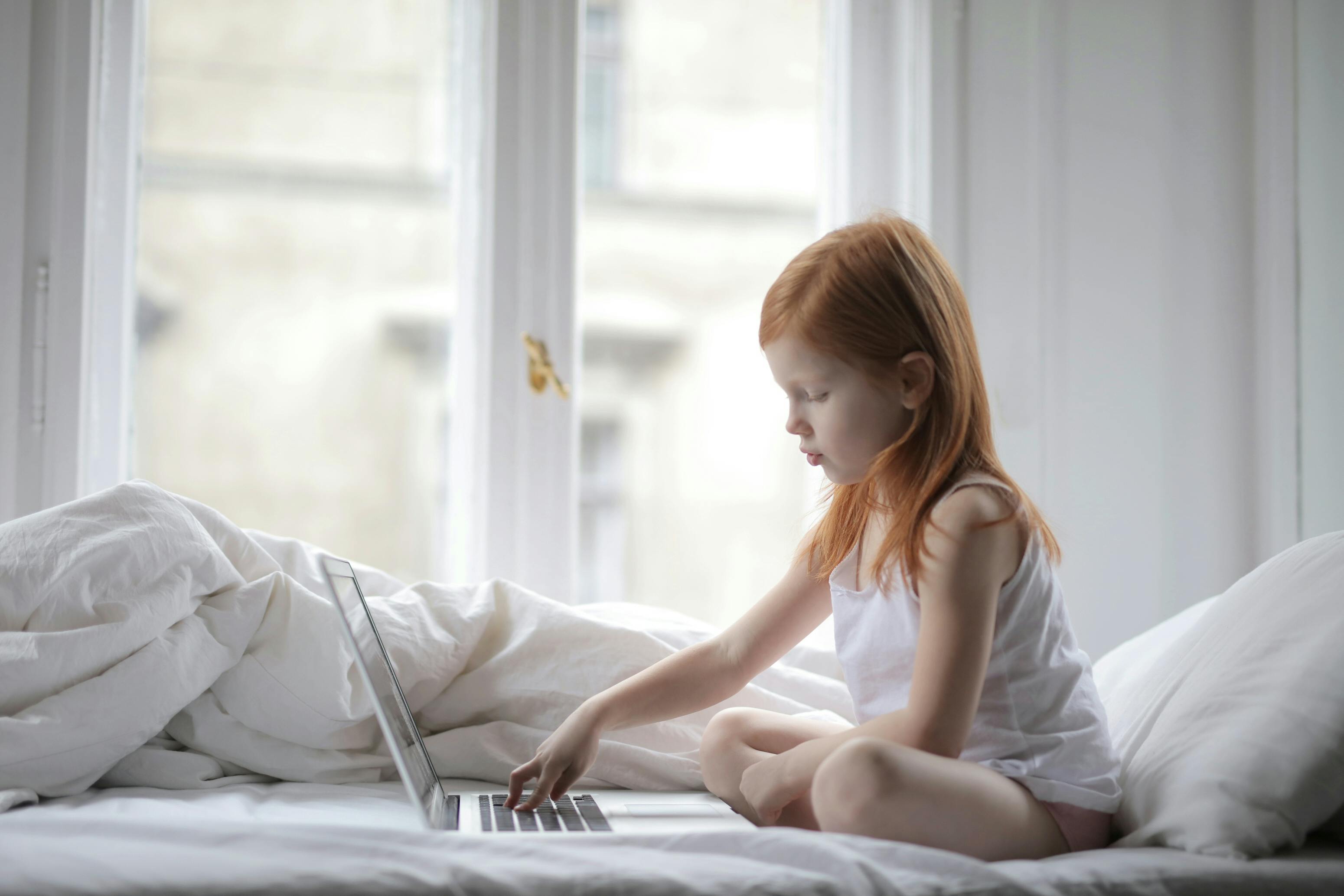 Photo Of Child Using Laptop · Free Stock Photo