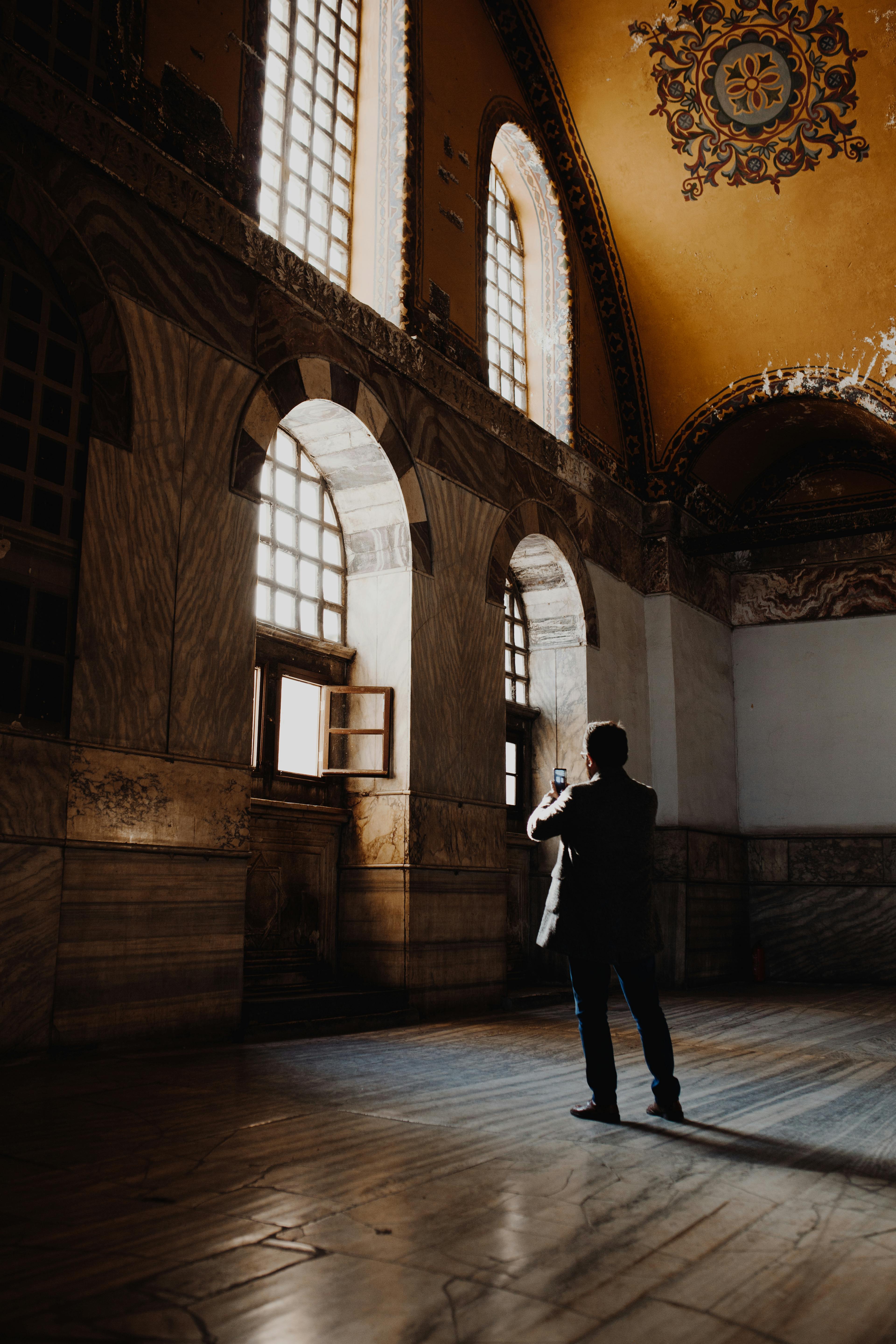 Man Standing Inside A Building · Free Stock Photo