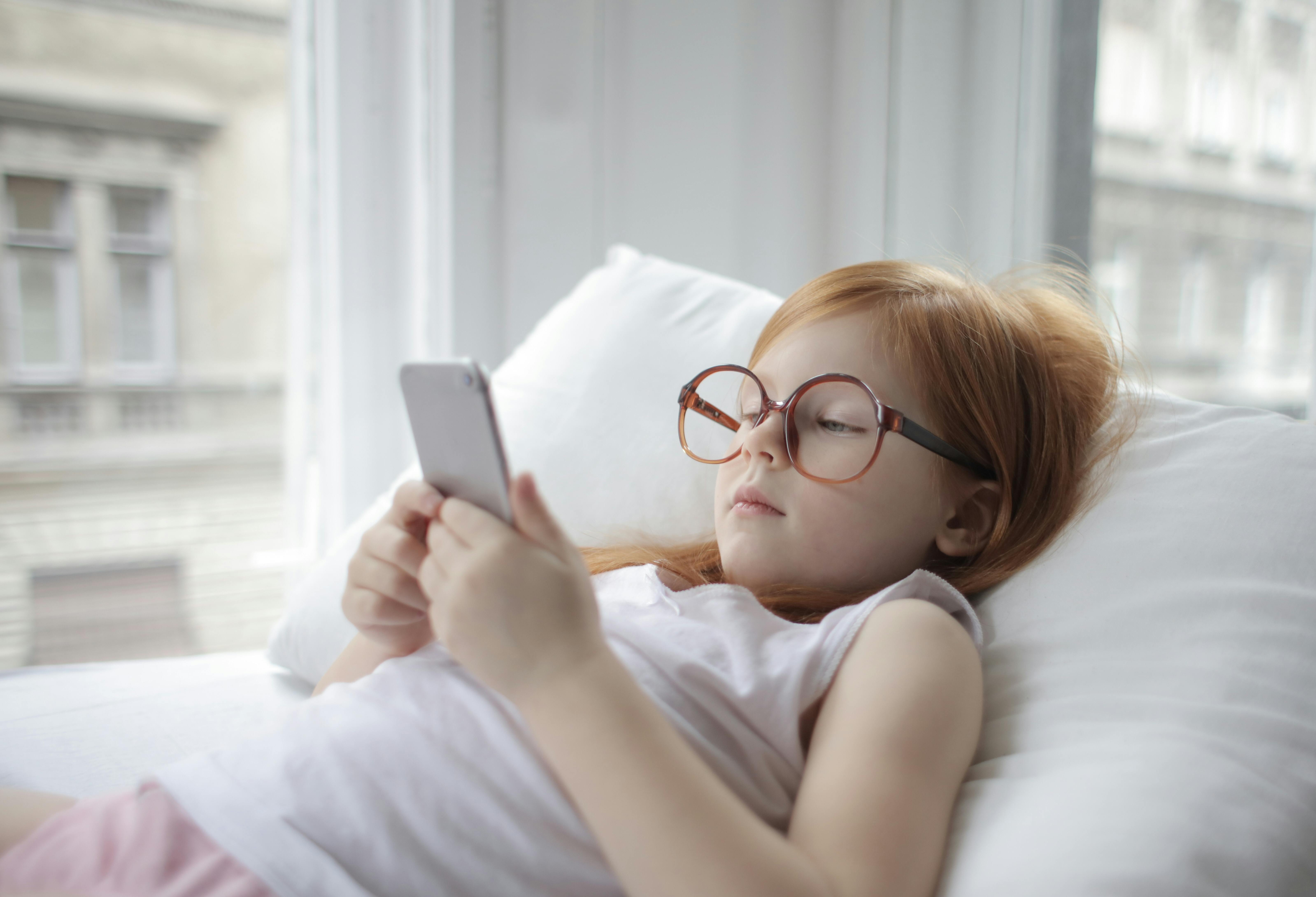 Photo Of Child Using Smartphone · Free Stock Photo