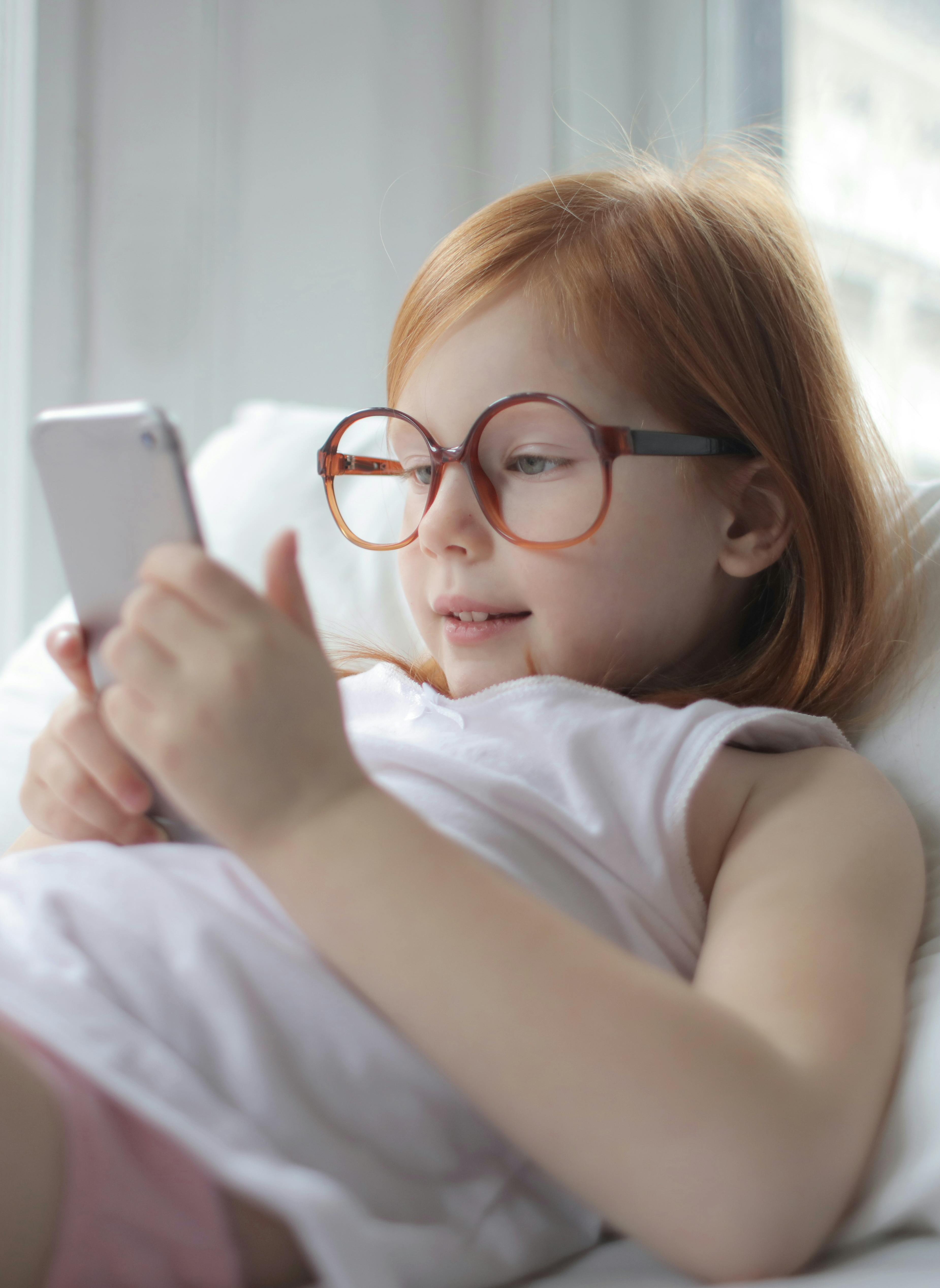 Photo Of Child Using Smartphone · Free Stock Photo