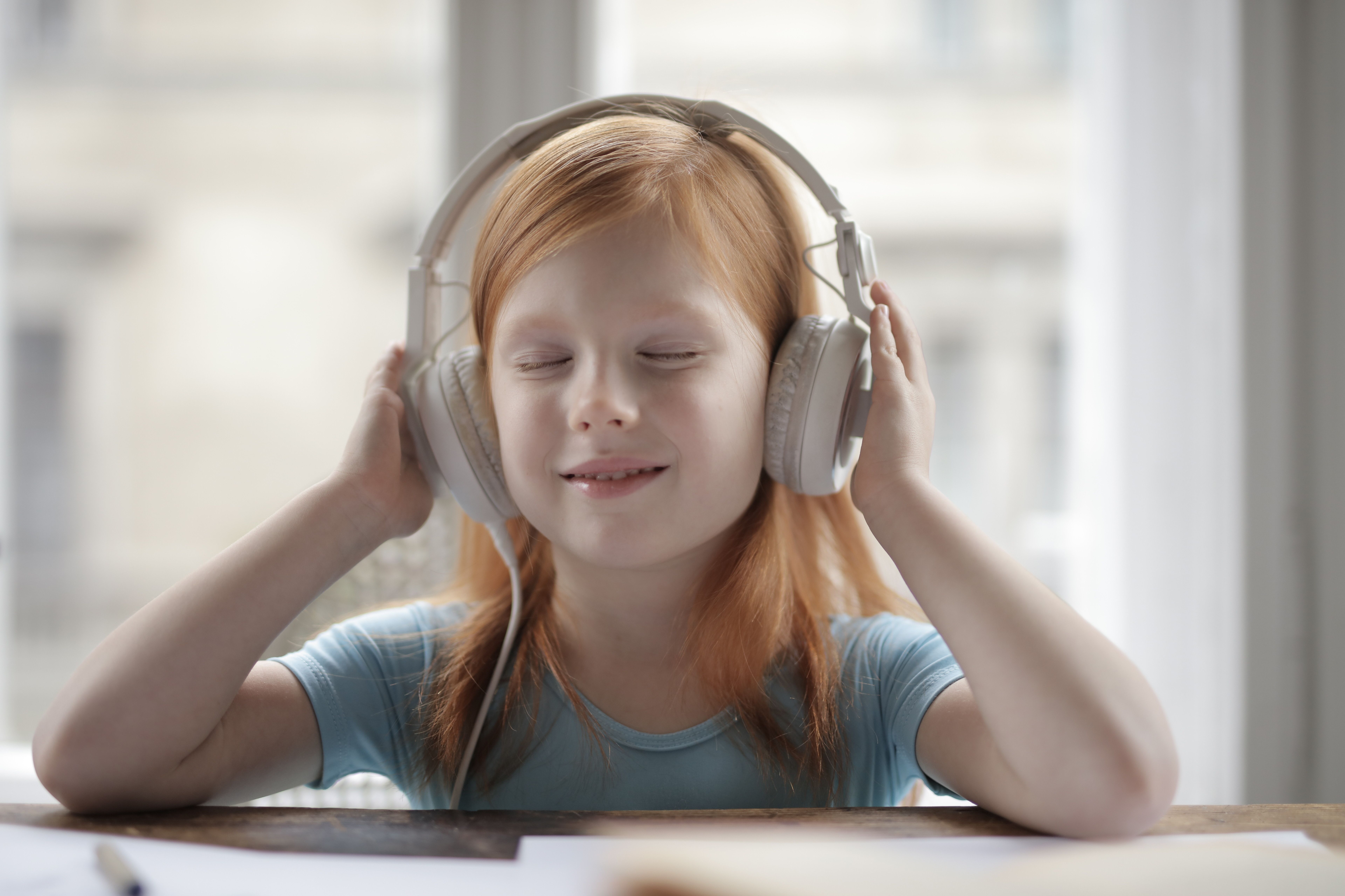 Photo Of Child Using Headphones · Free Stock Photo