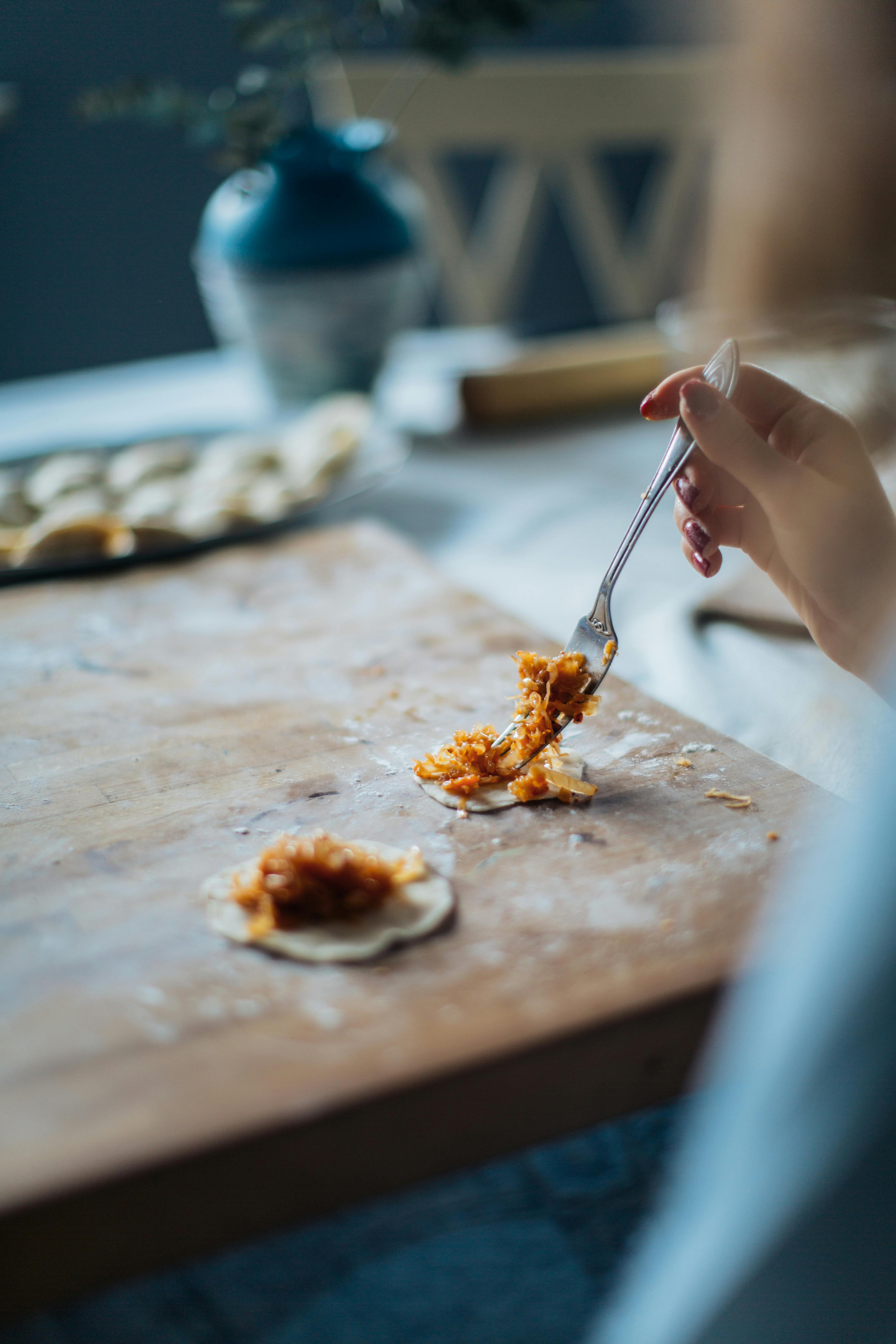 Person Holding Silver Fork · Free Stock Photo