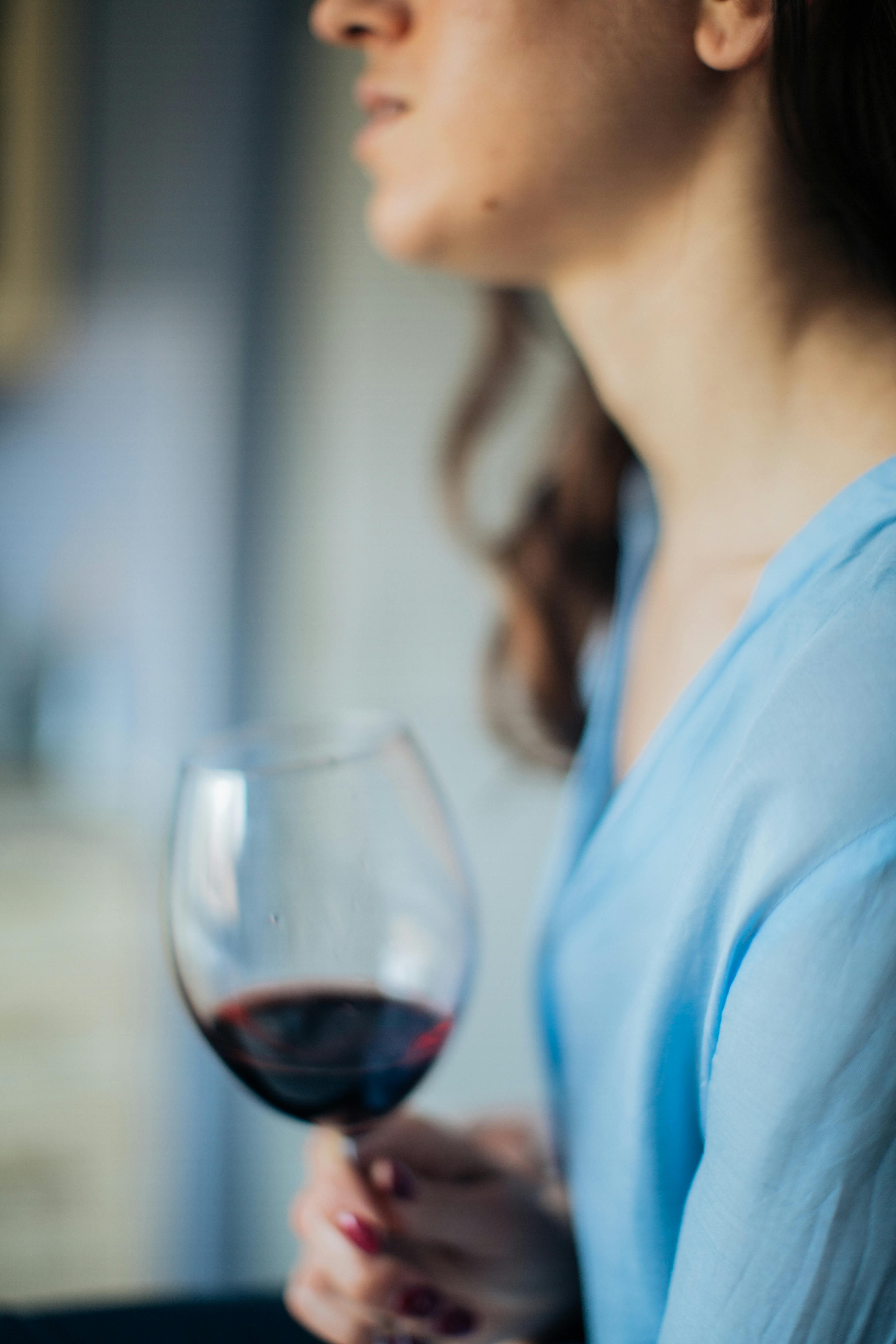 Photo Of Woman Near Wine Glass · Free Stock Photo