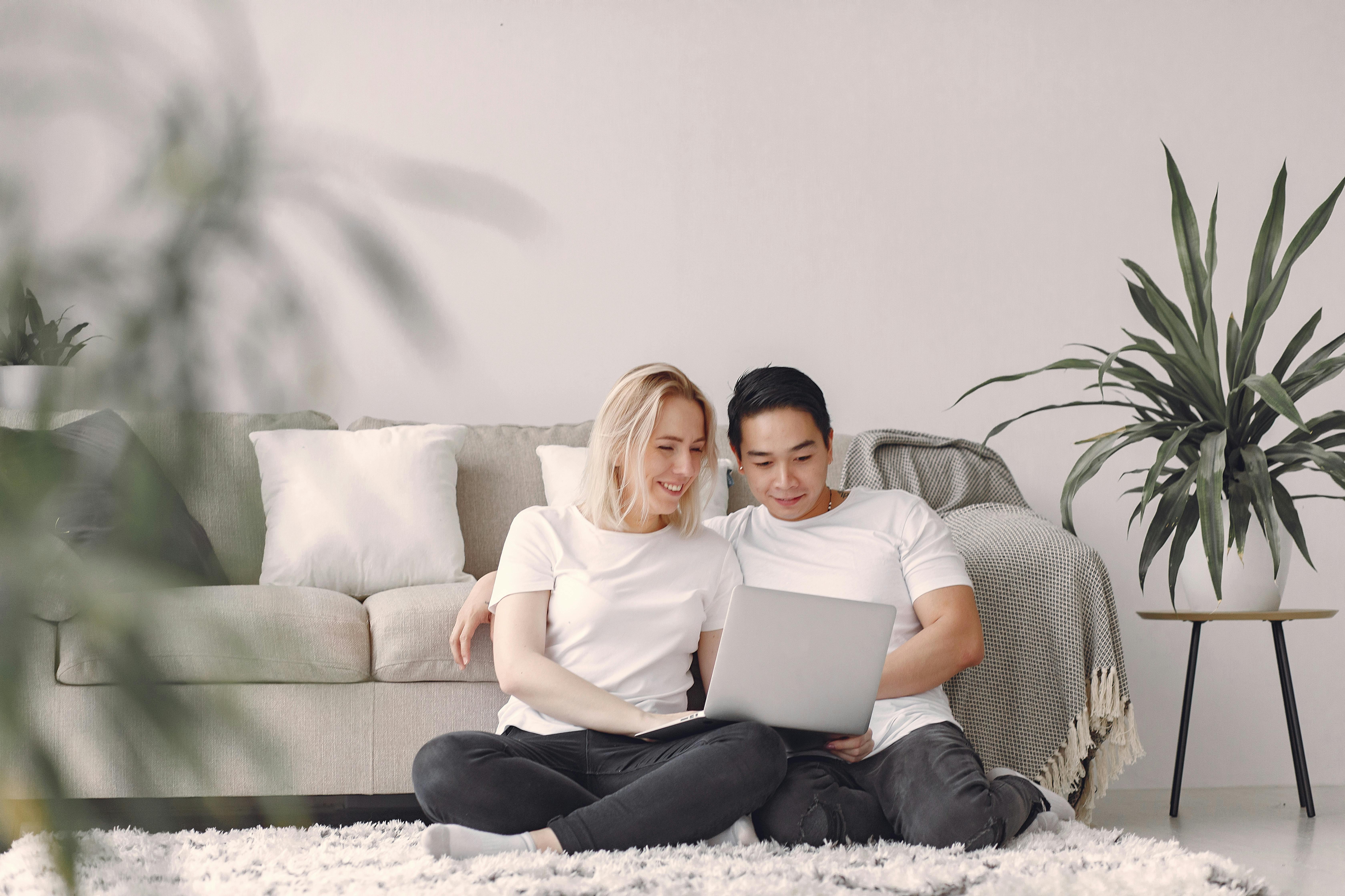 Man And Woman In White Crew Neck T-shirt Sitting On A Rug · Free Stock ...