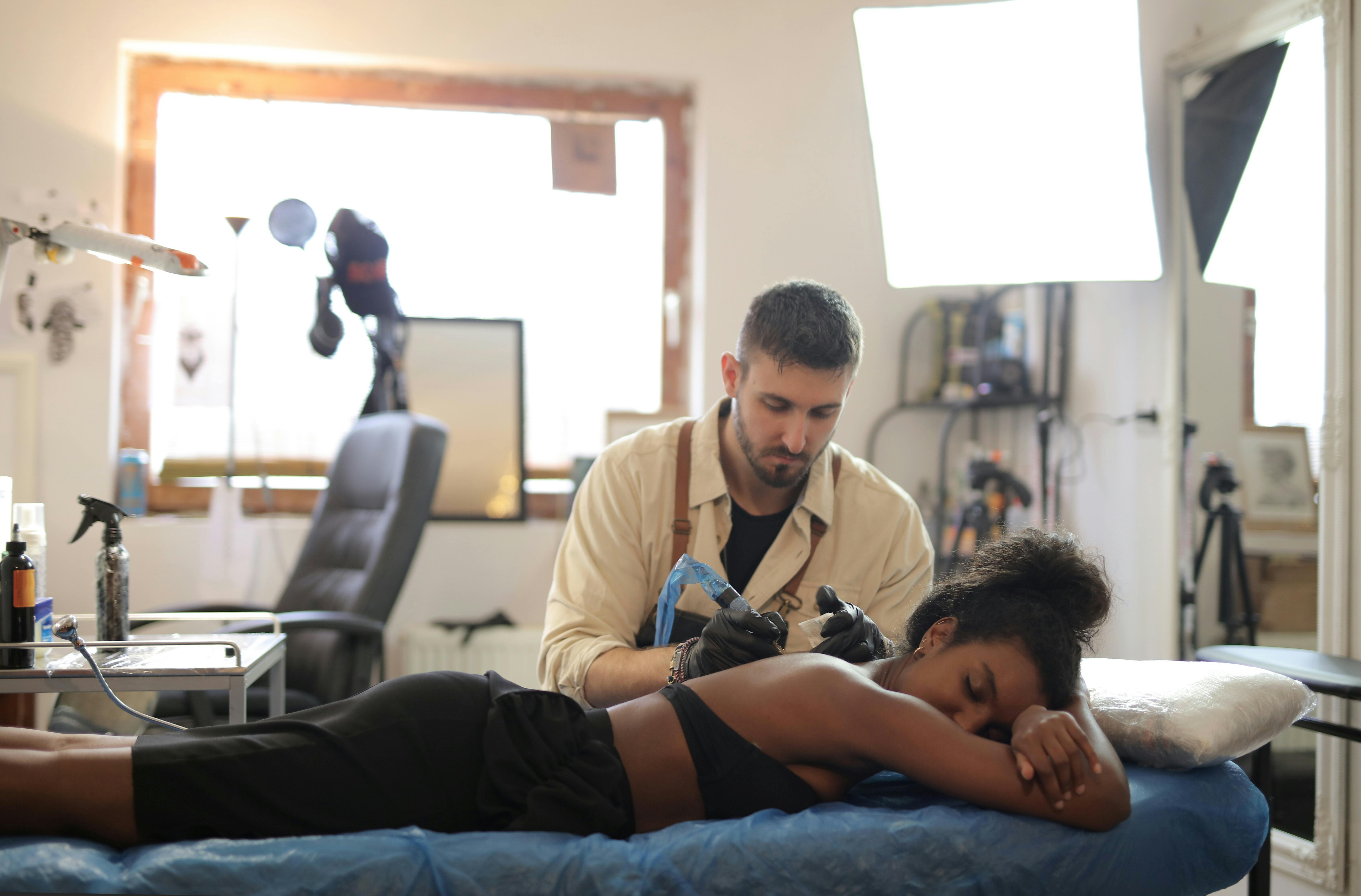 Woman Getting Tattoo · Free Stock Photo