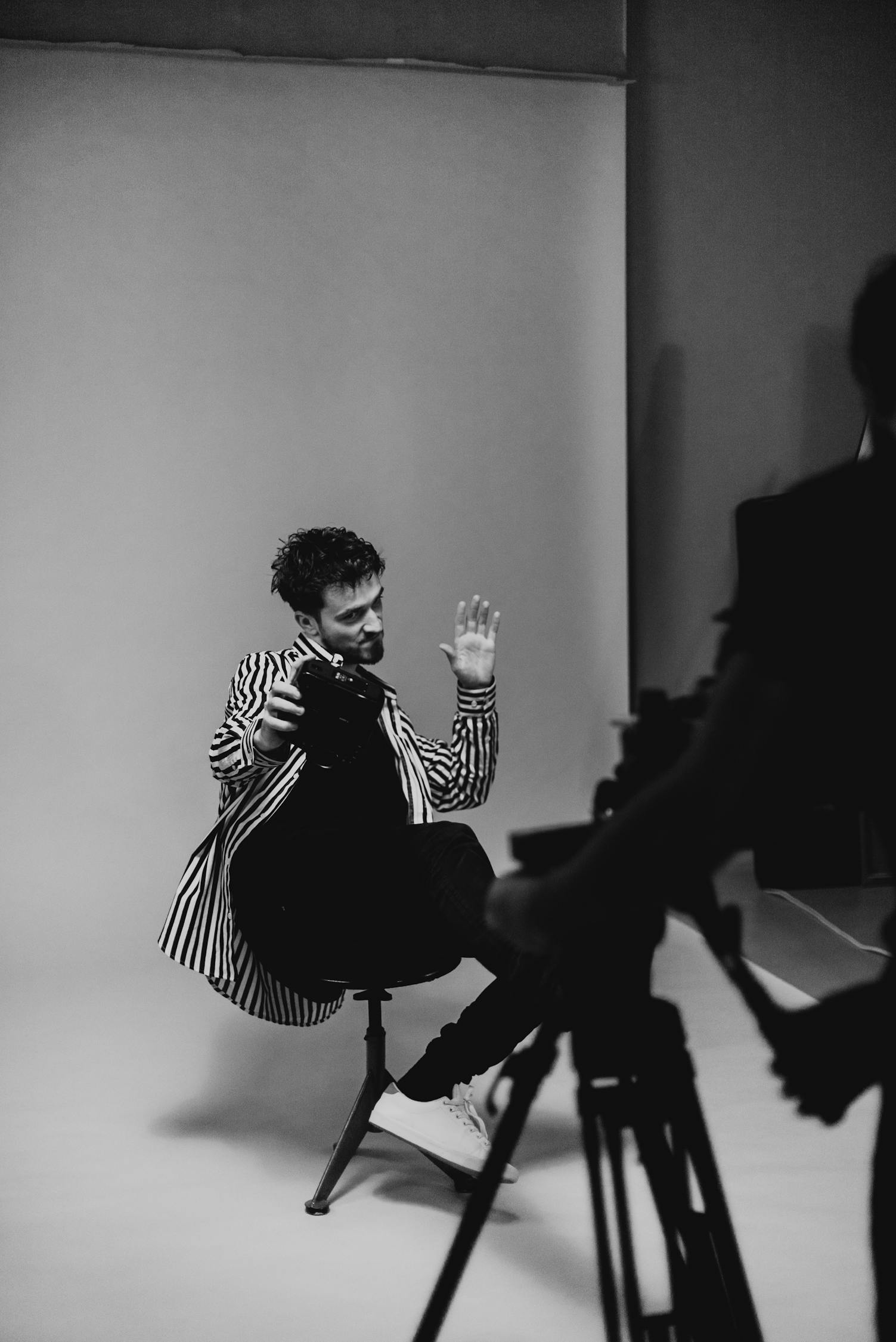 Photo Of Man Sitting On Stool · Free Stock Photo Photo Of Man Sitting On Stool · Free Stock Photo