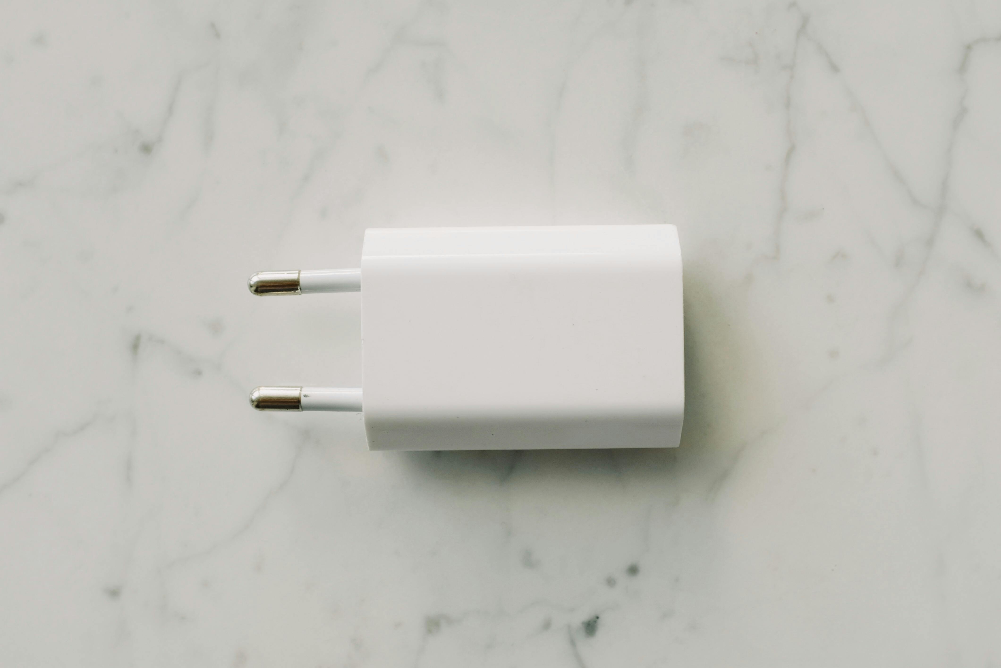 White Adapter On White Surface · Free Stock Photo