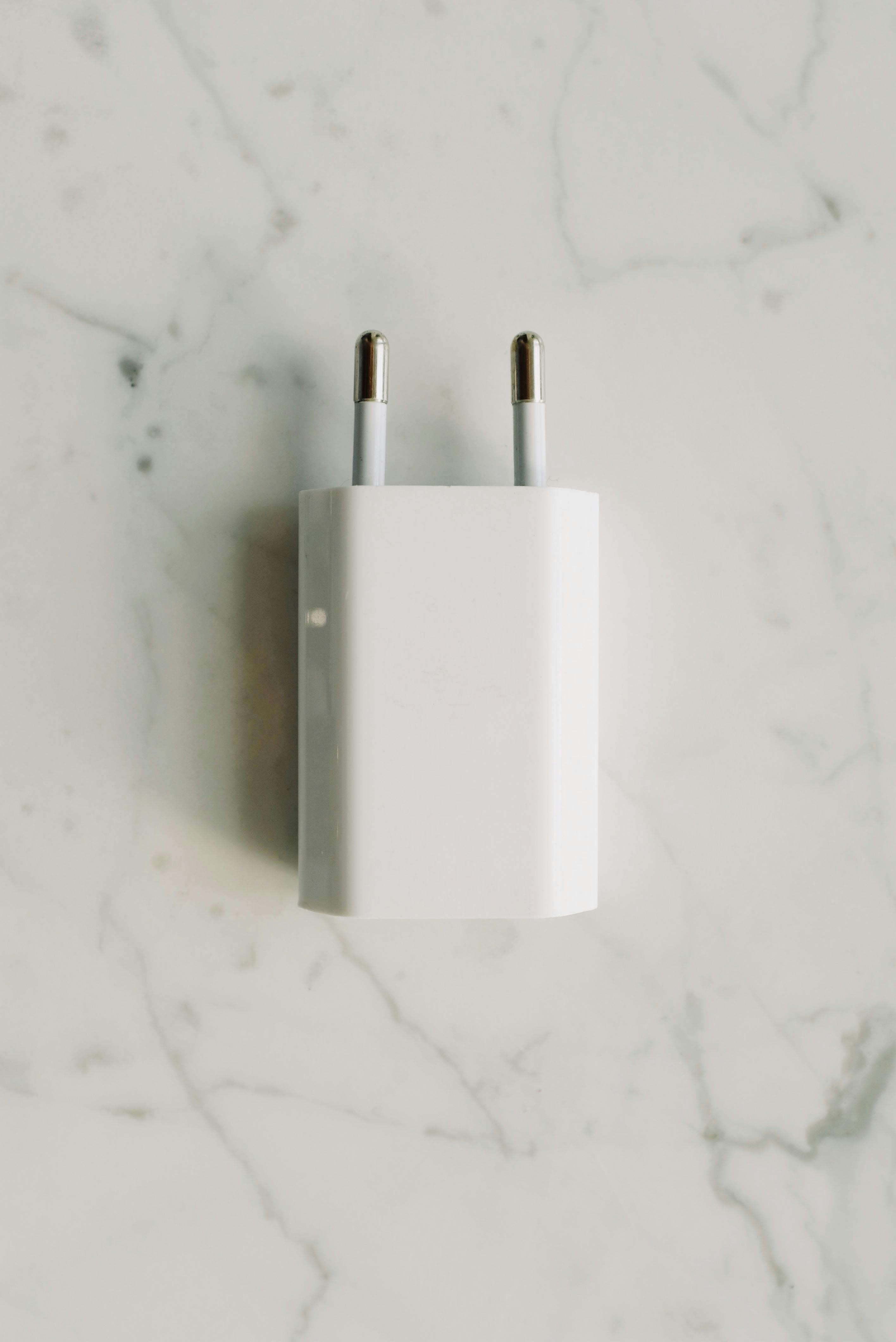 White Adapter On White Surface · Free Stock Photo