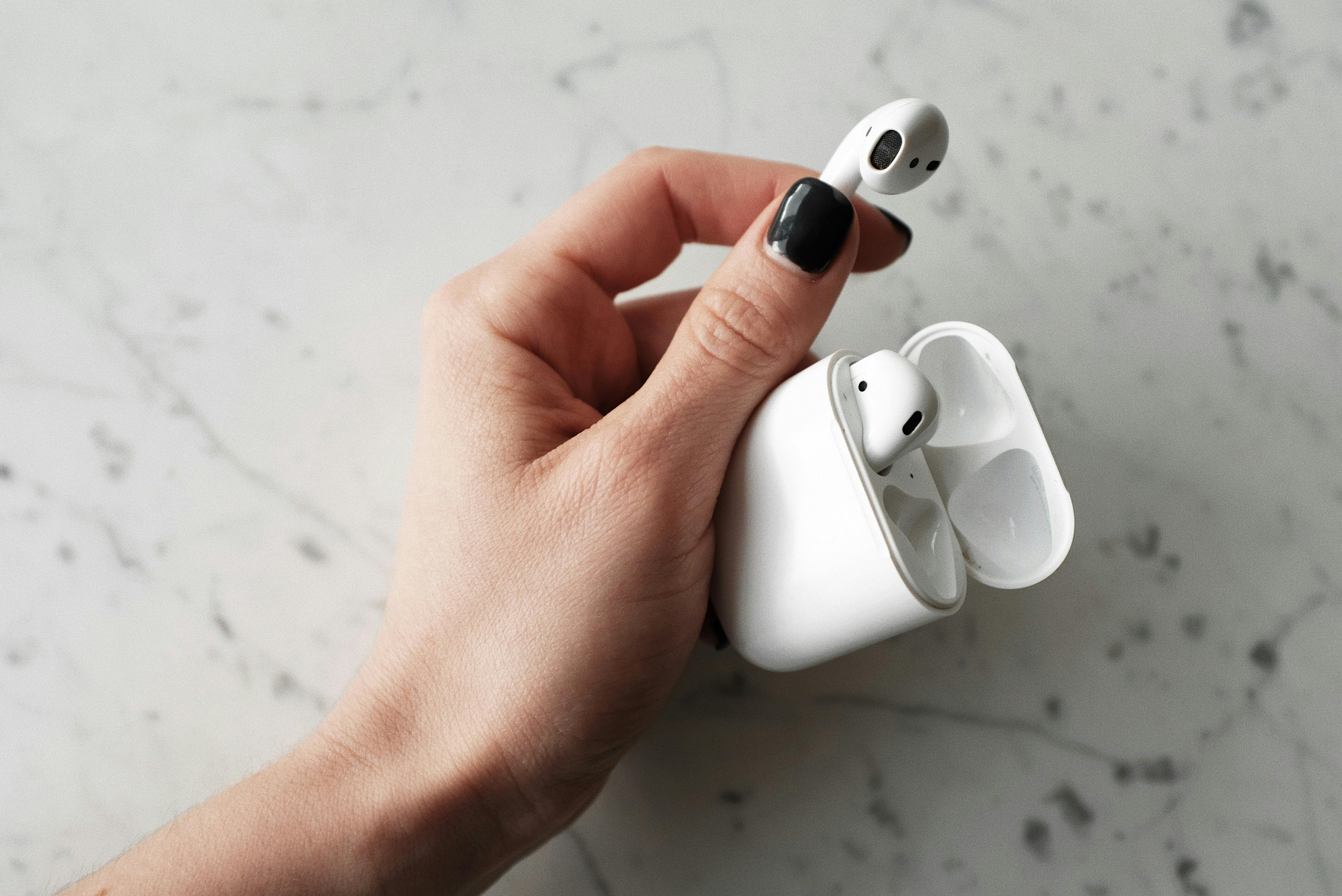 Photo of Person Holding Apple Airpods · Free Stock Photo