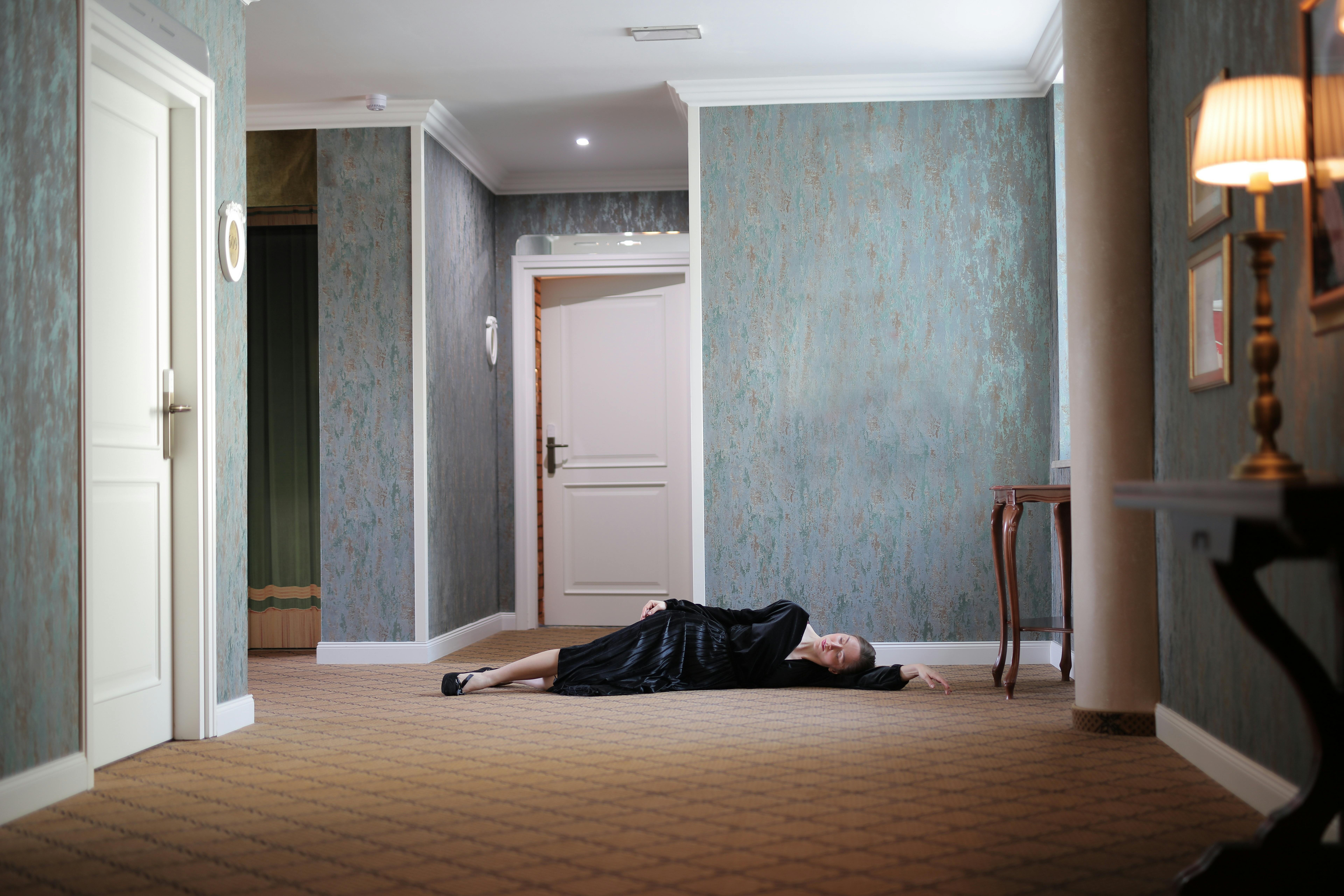 Person Lying On The Floor Near A Door · Free Stock Photo