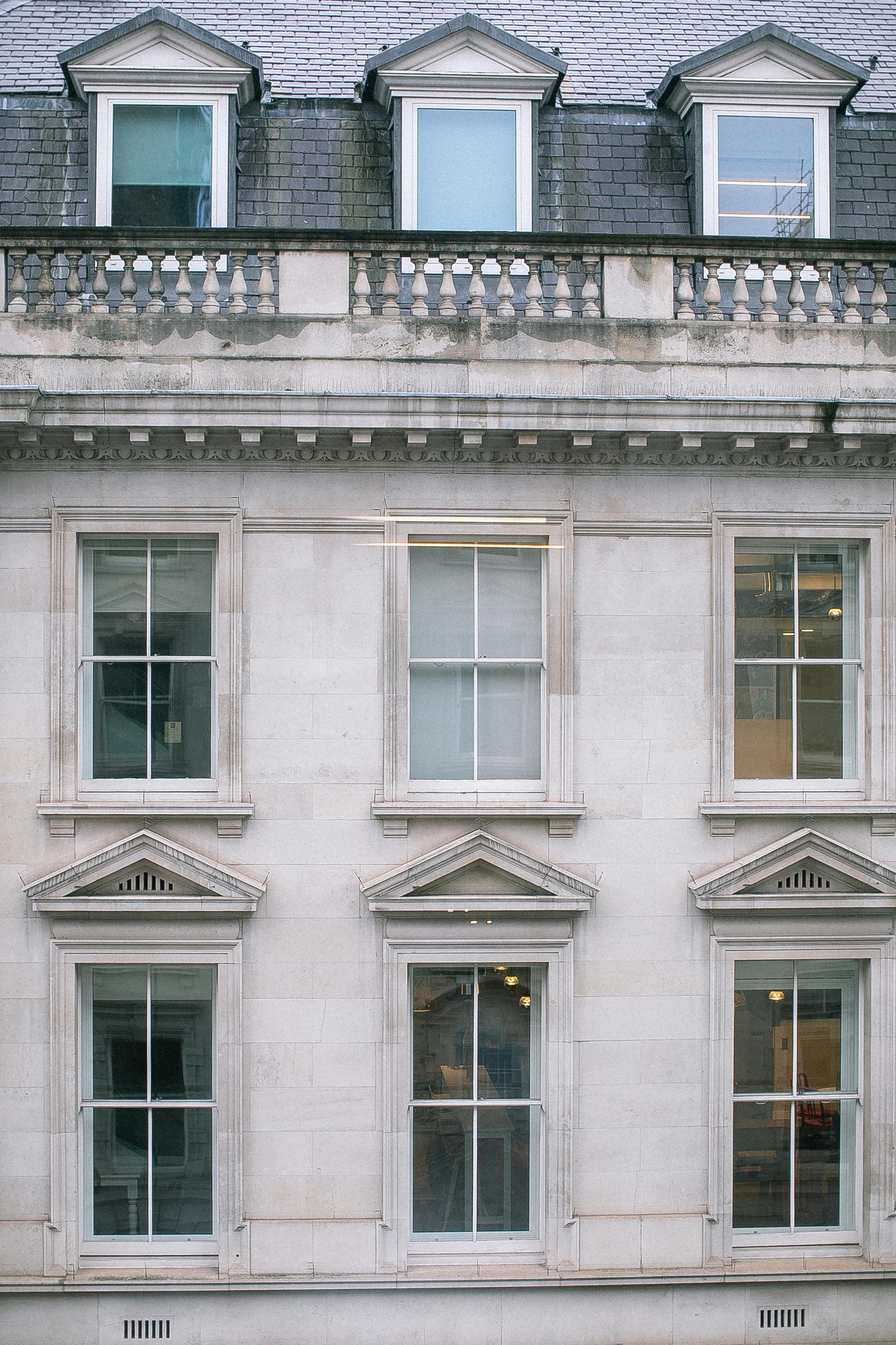 White Concrete Building With Glass Windows · Free Stock Photo