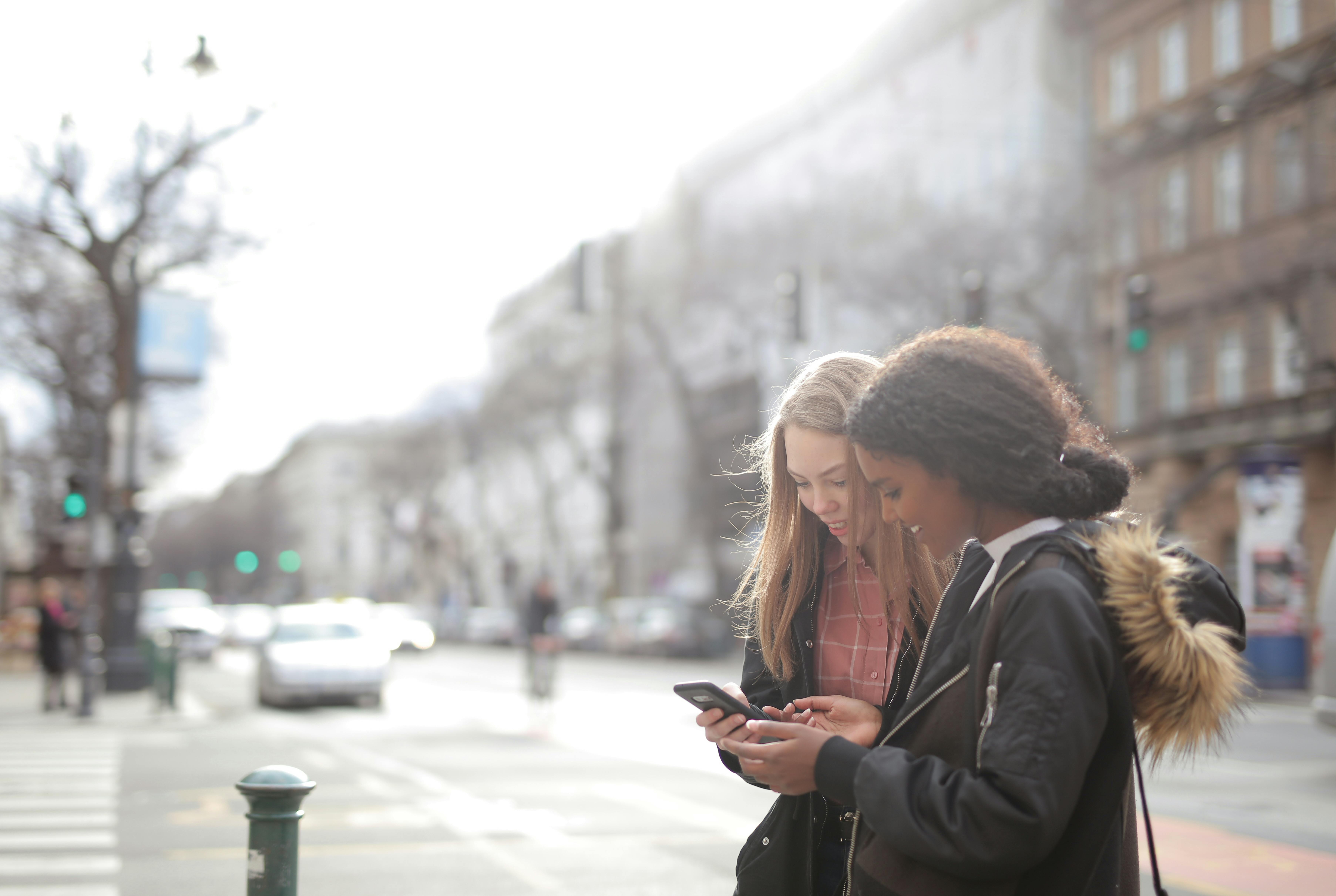 Women Looking At Mobile Phone · Free Stock Photo