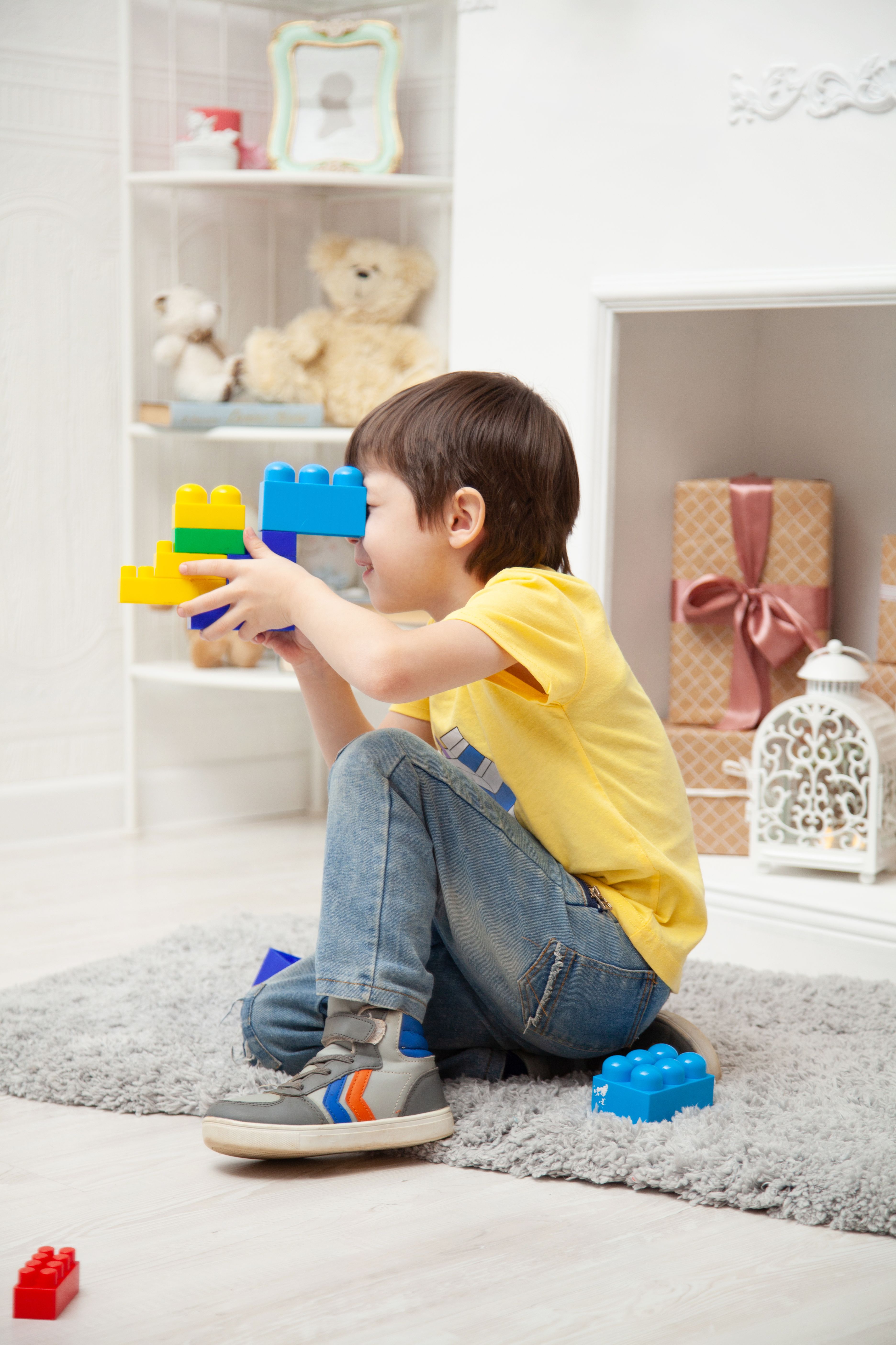 Little Boy Building with Blocks in a Living Room · Free Stock Photo
