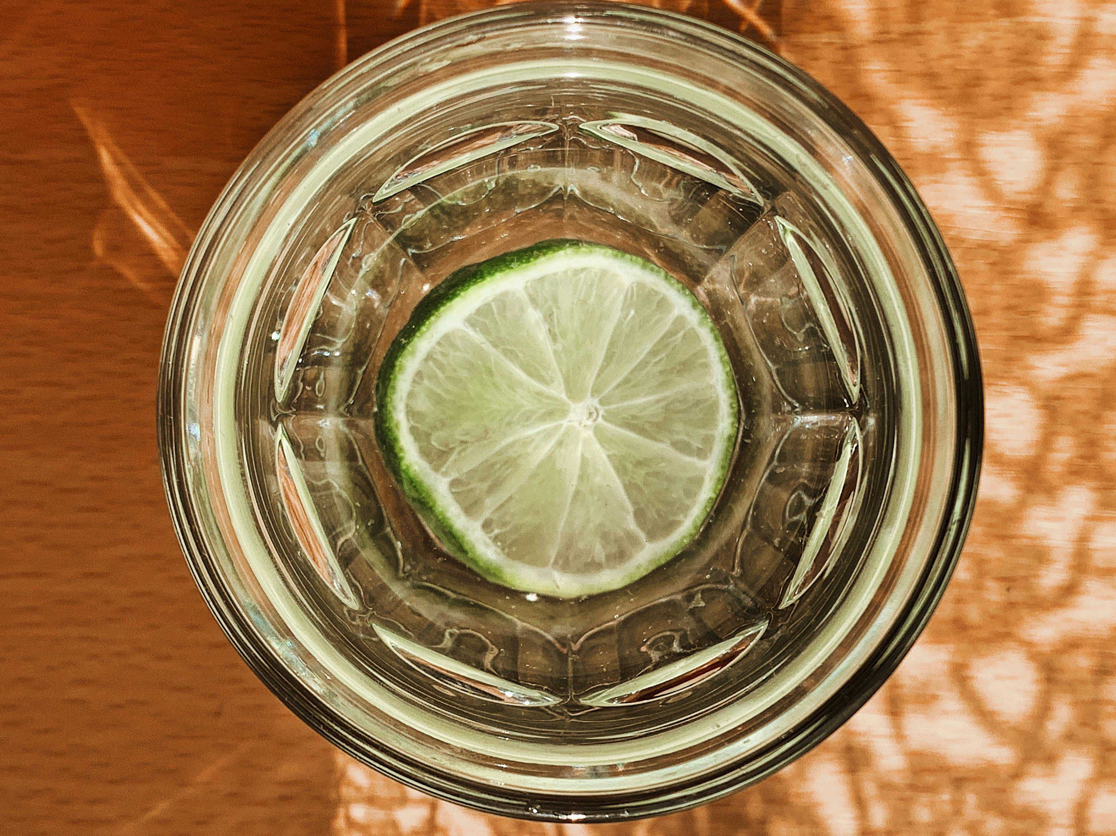 Clear Drinking Glass With Sliced Lemon · Free Stock Photo