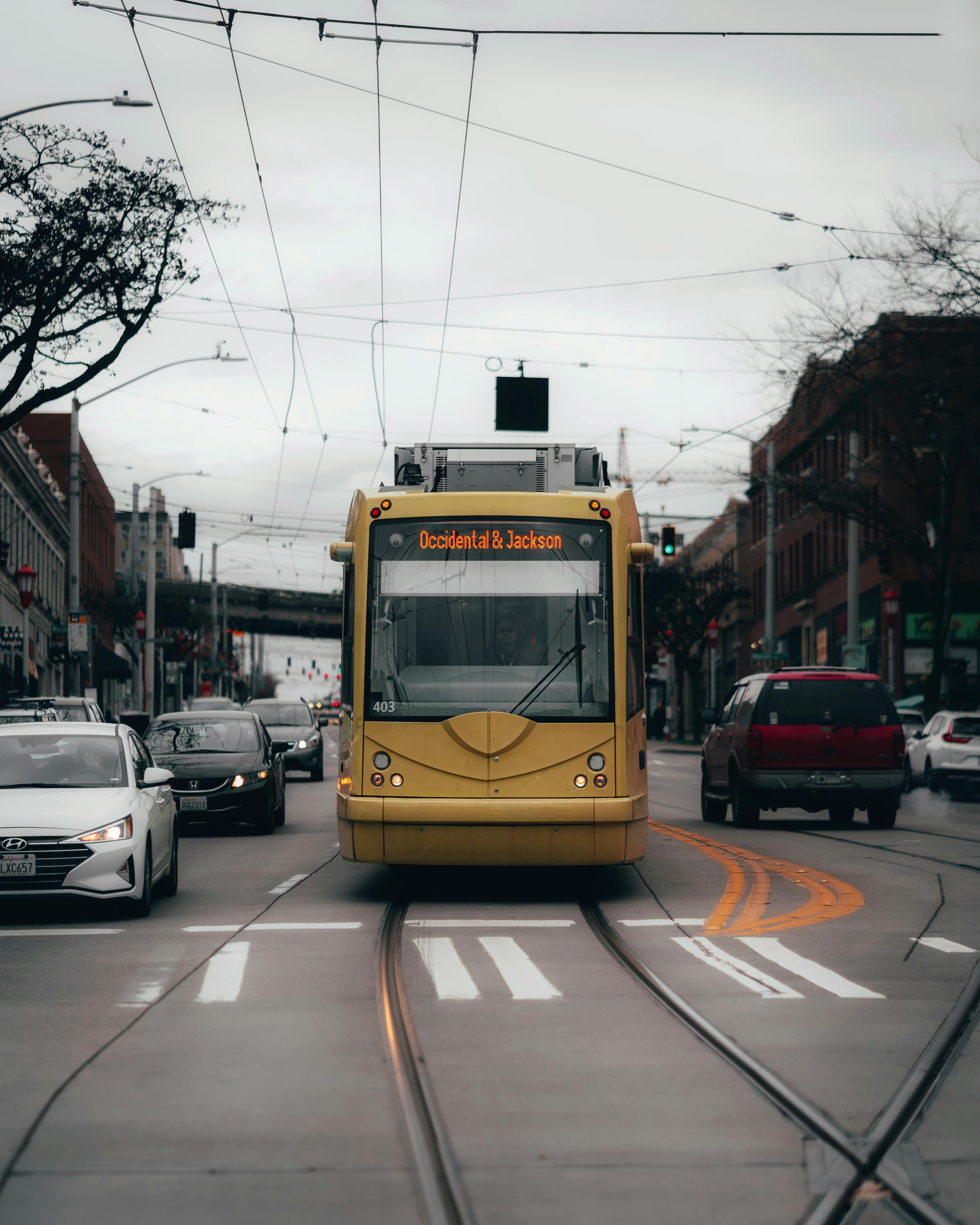 Yellow Tram On The Road · Free Stock Photo