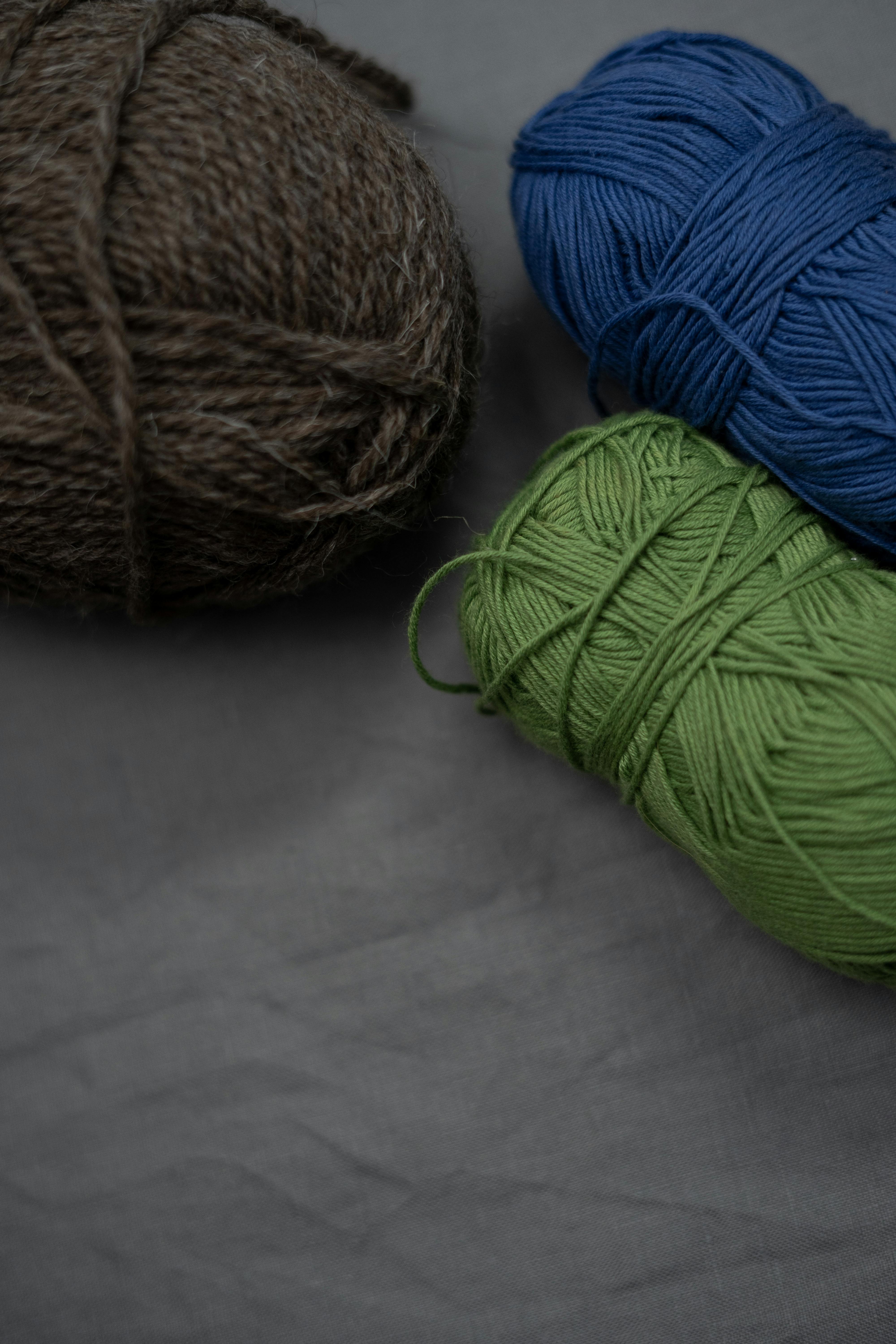 Person Holding Brown Yarn Roll · Free Stock Photo