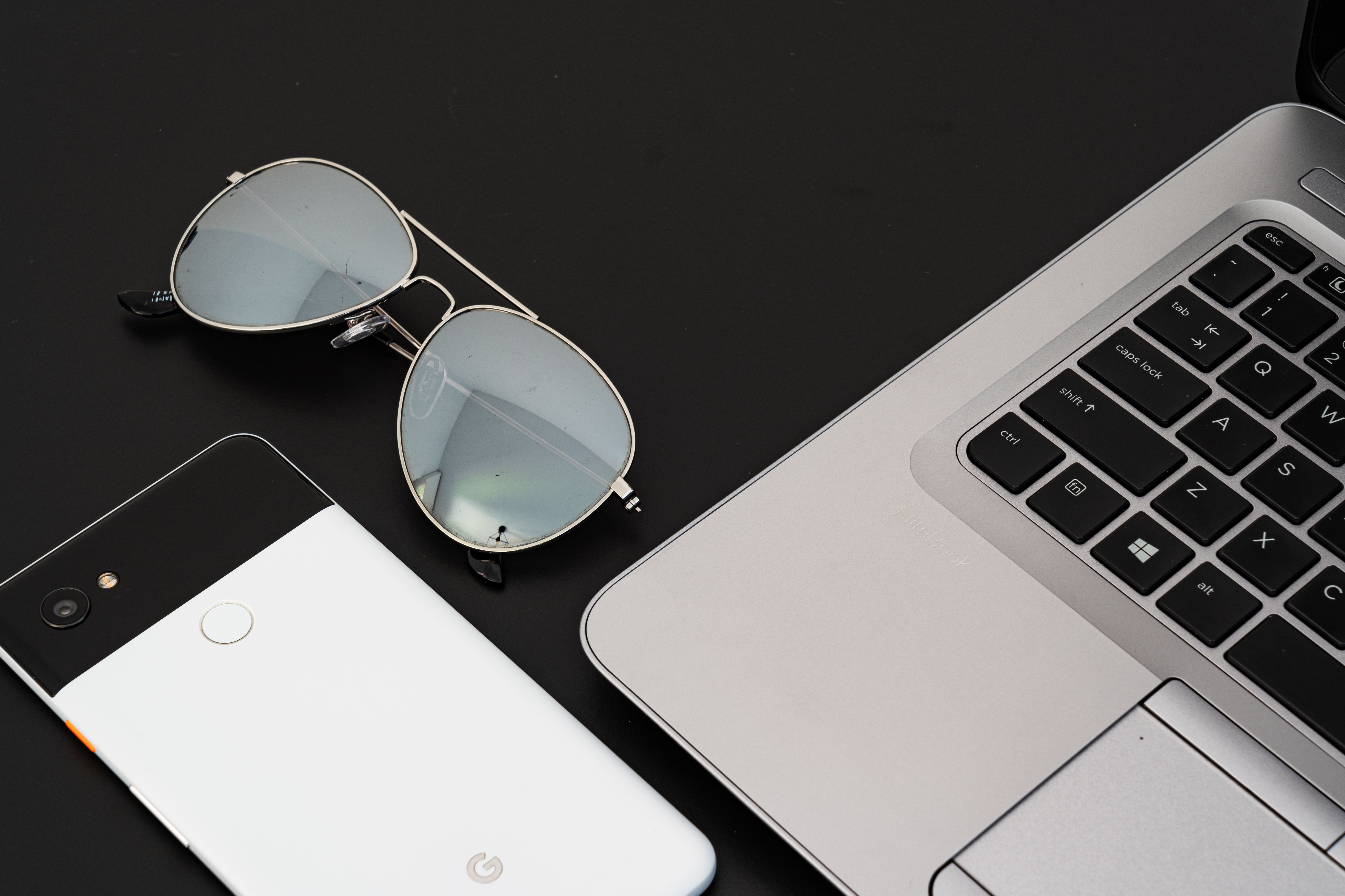 Smartphone Beside a Laptop · Free Stock Photo