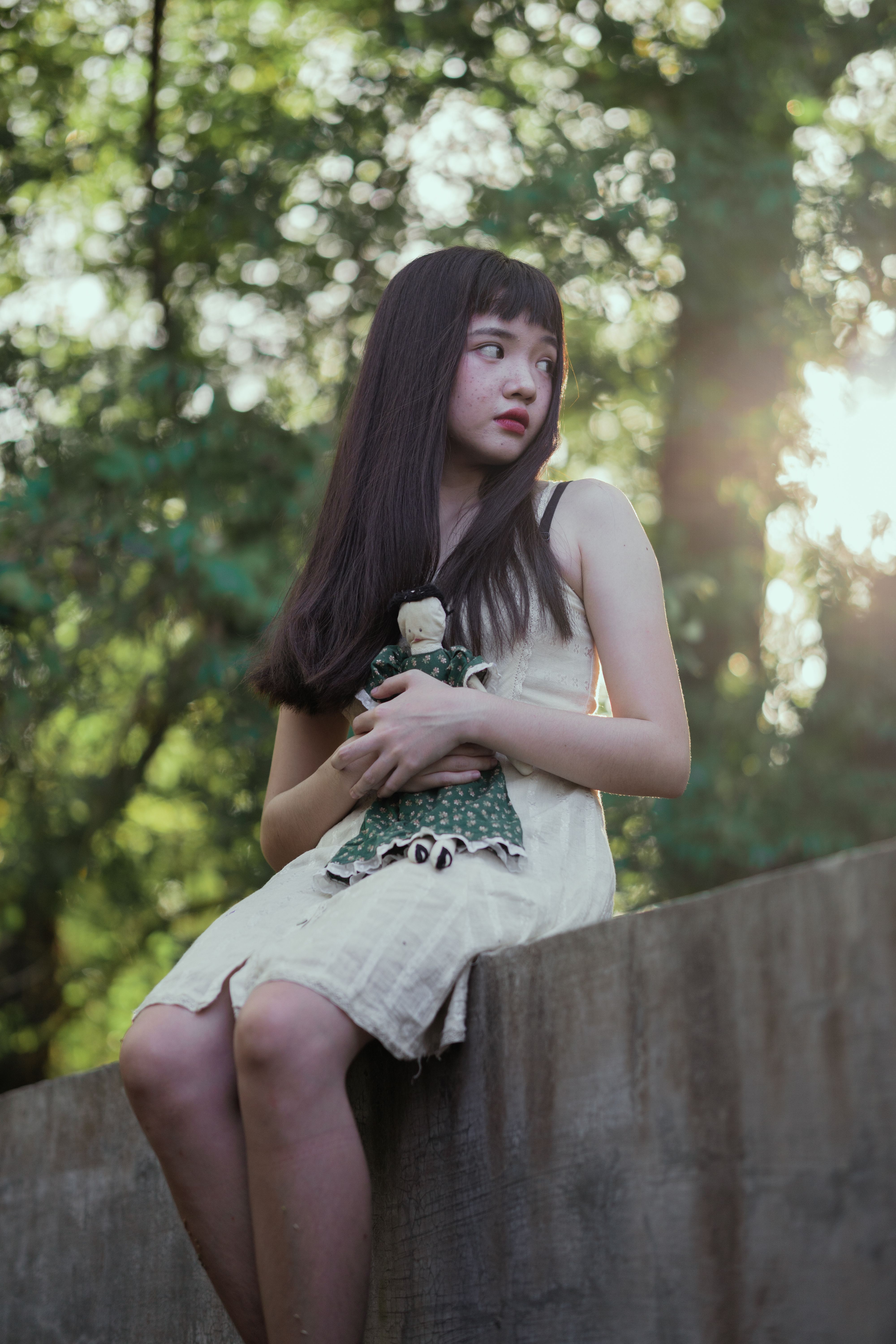 Girl Holding A Doll · Free Stock Photo