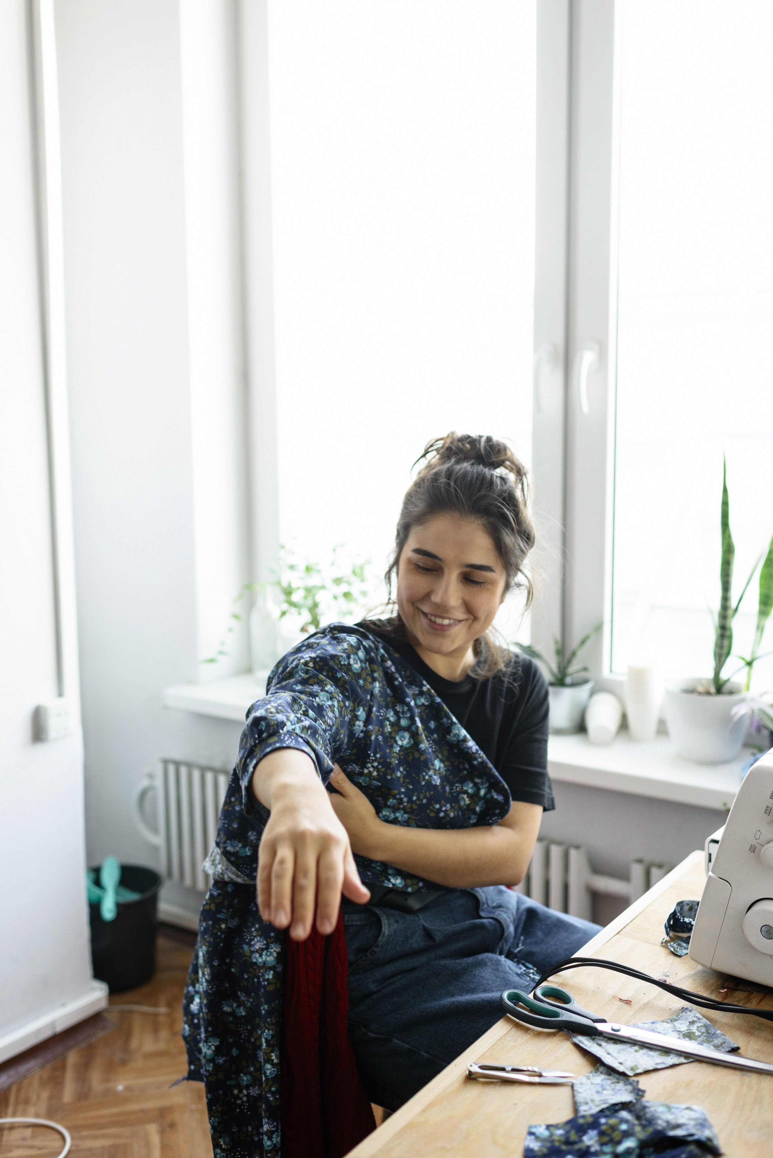 Woman tailor fitting jacket in workshop · Free Stock Photo