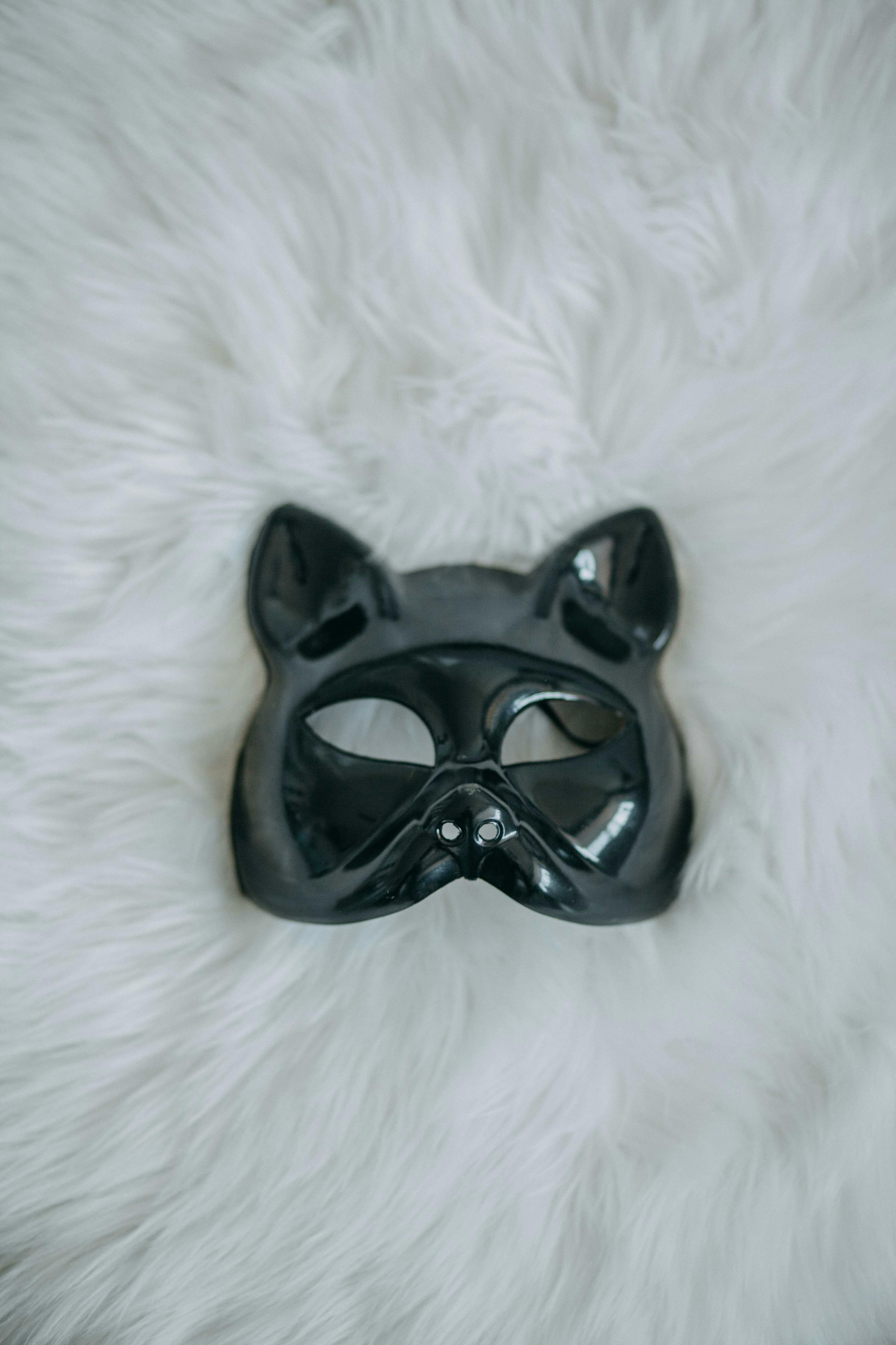 Black Animal Mask on White Fur · Free Stock Photo