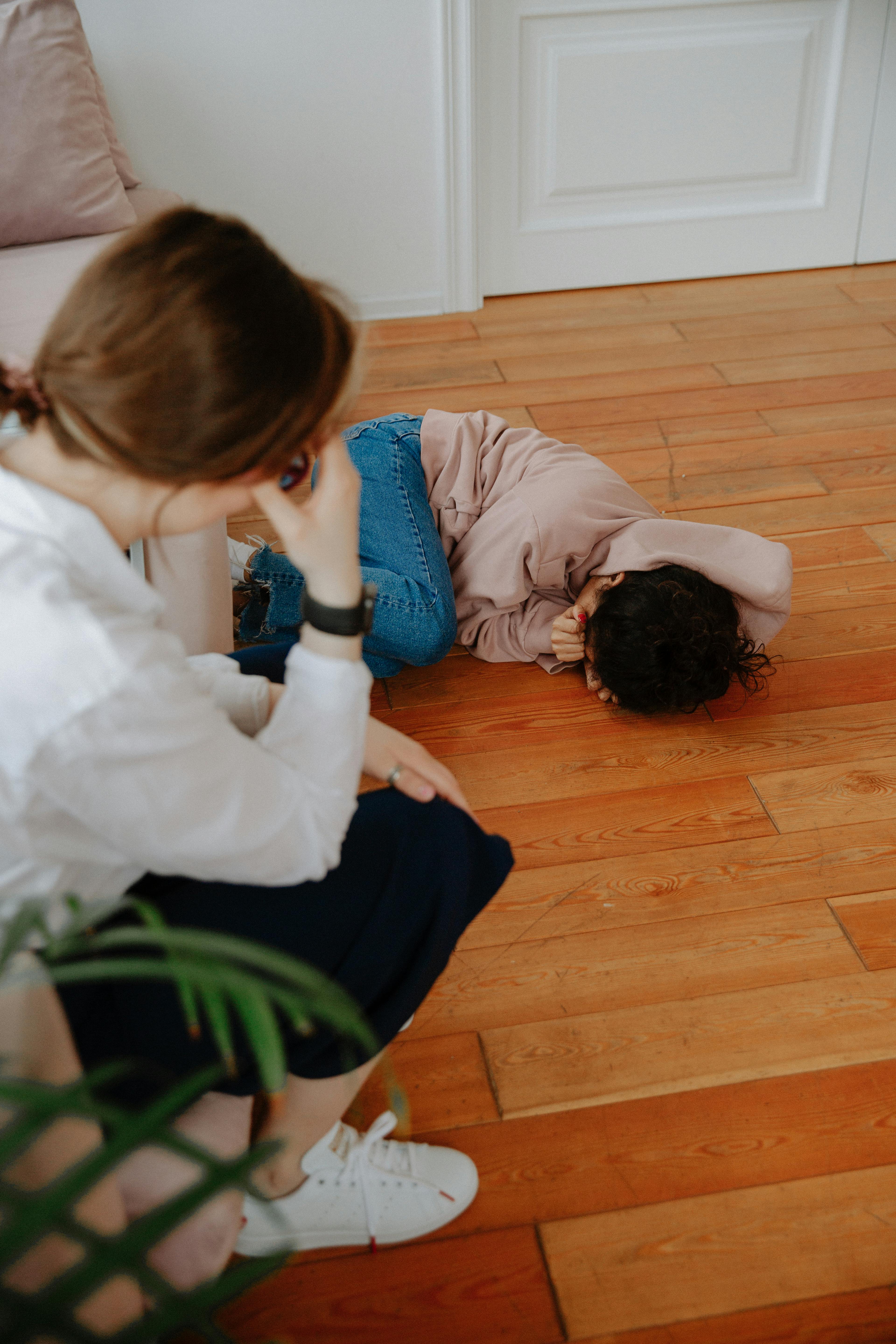 Young Woman Crying on Floor · Free Stock Photo