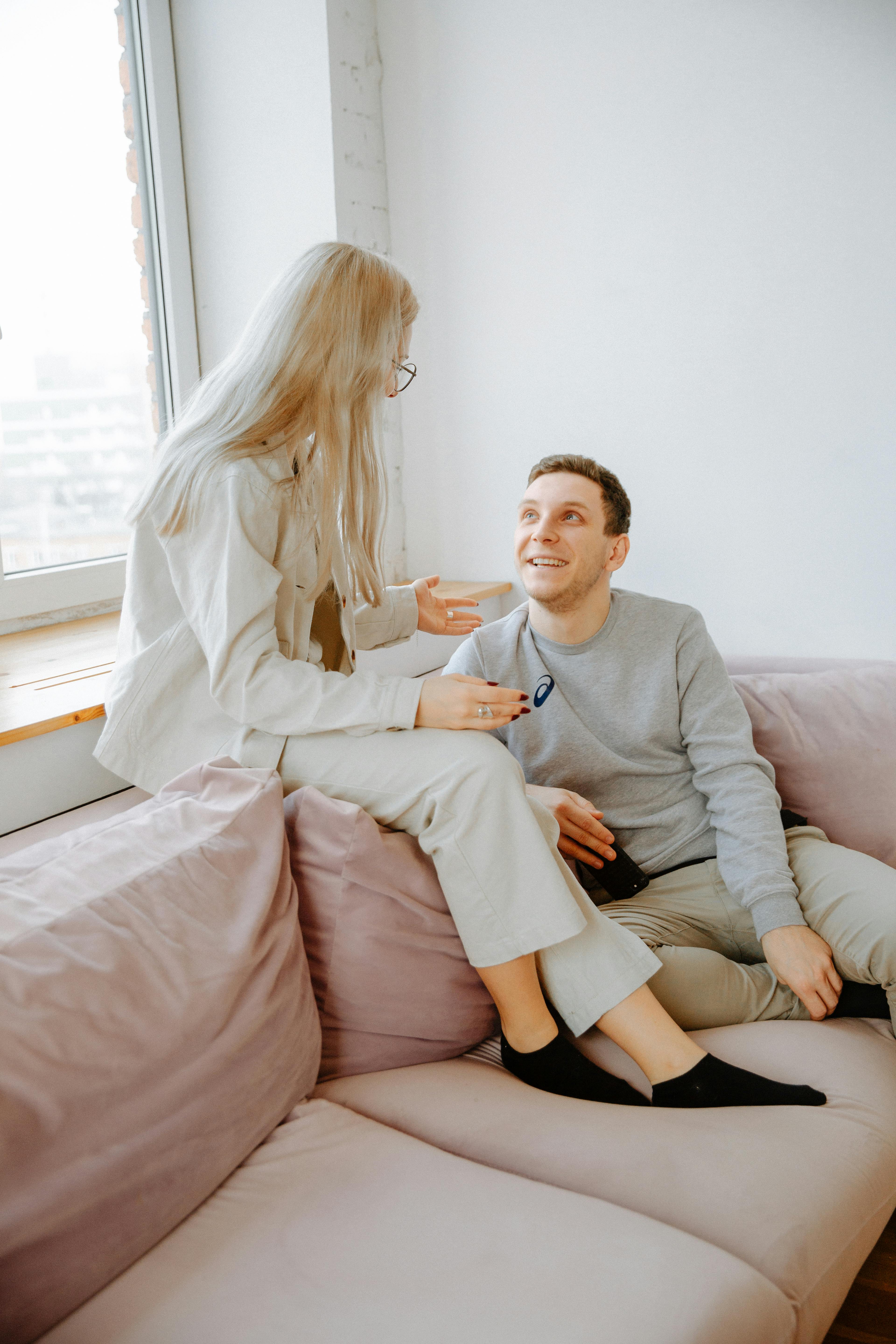 Couple Talking on Couch · Free Stock Photo