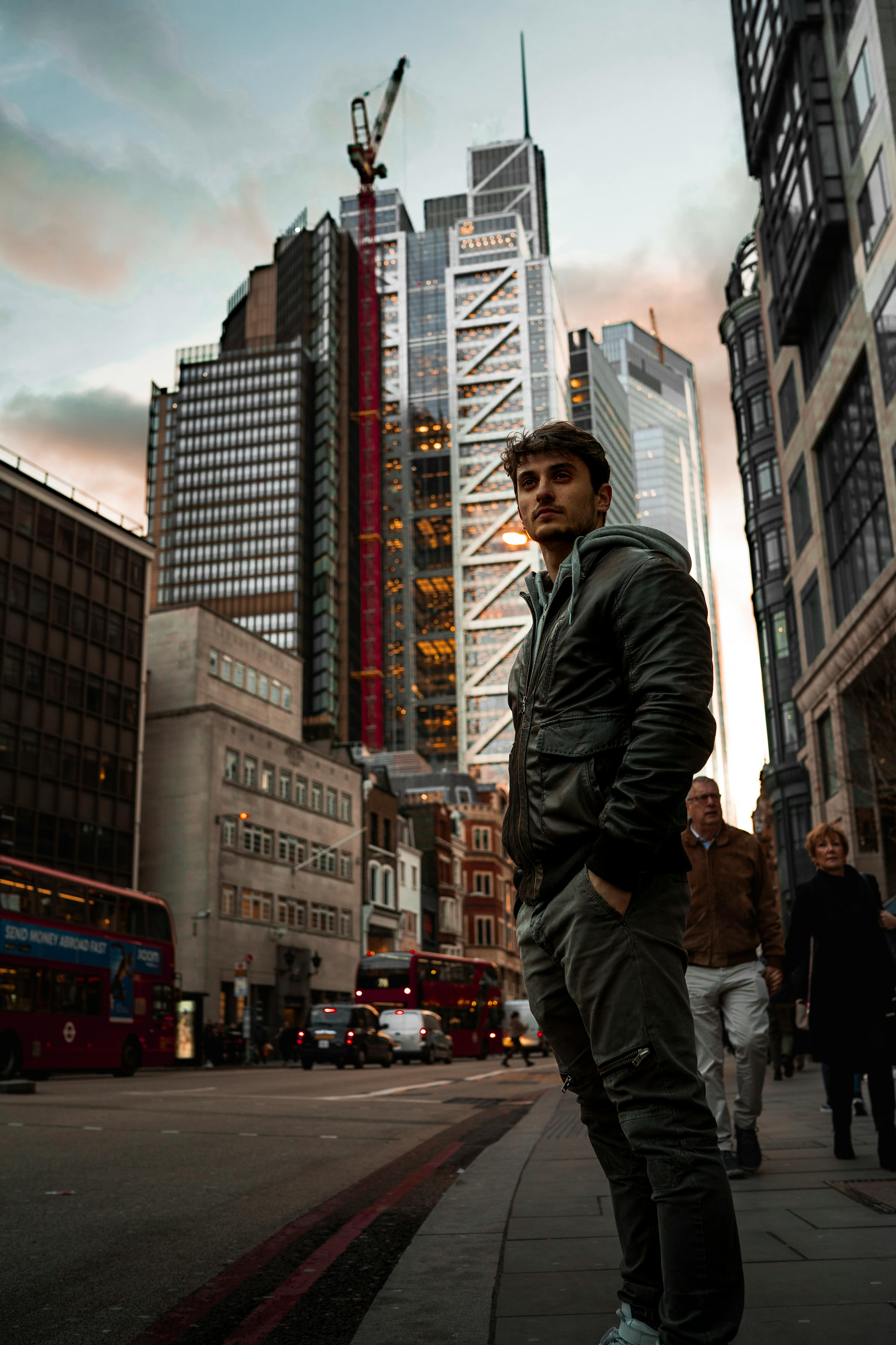Man Walking Near Buildings · Free Stock Photo