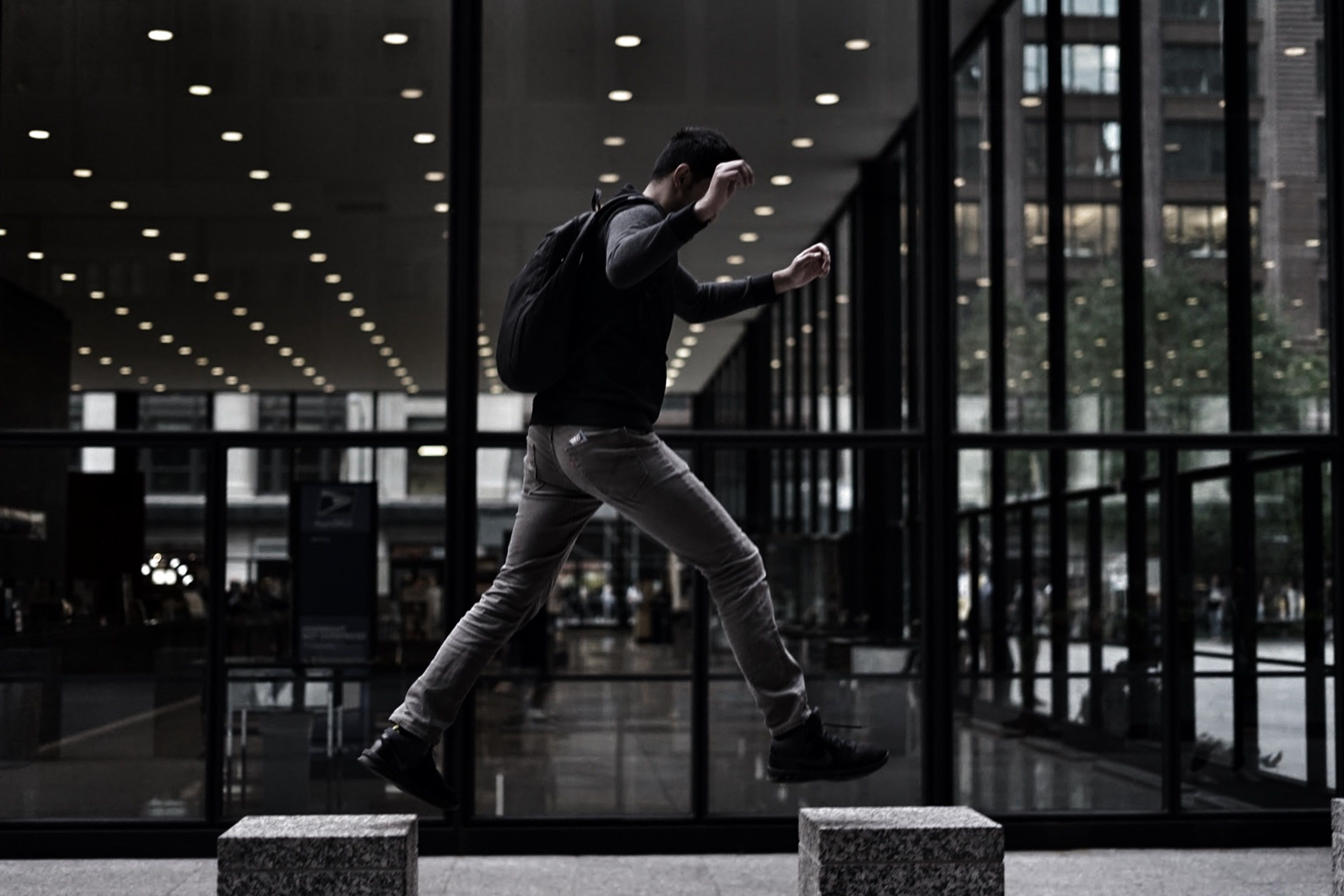 Unrecognizable man stepping onto concrete platform in modern style ...