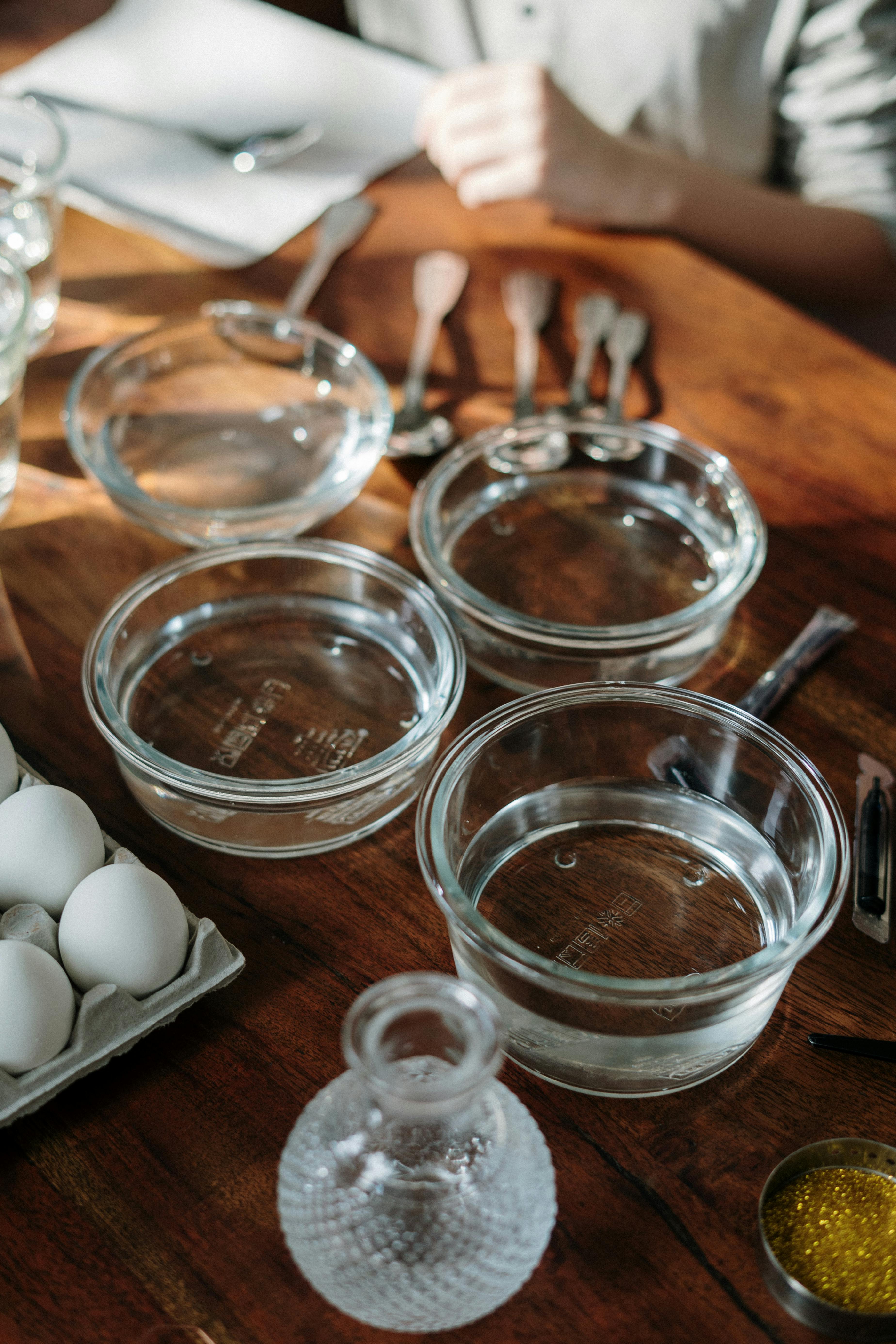 Clear Glass Bowls on Wooden Table with Water · Free Stock Photo