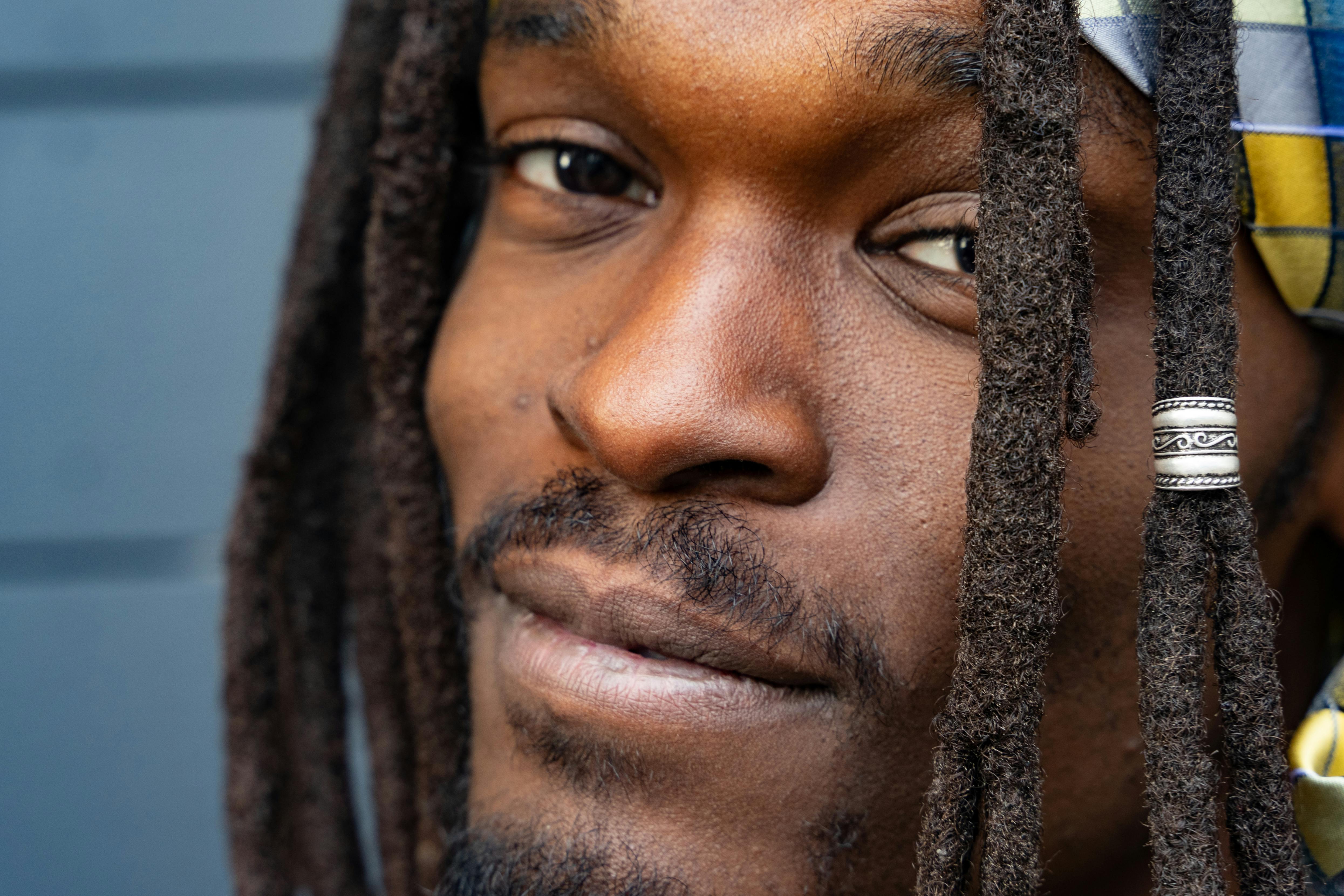 Portrait of a Man with Dreadlocks Posing · Free Stock Photo