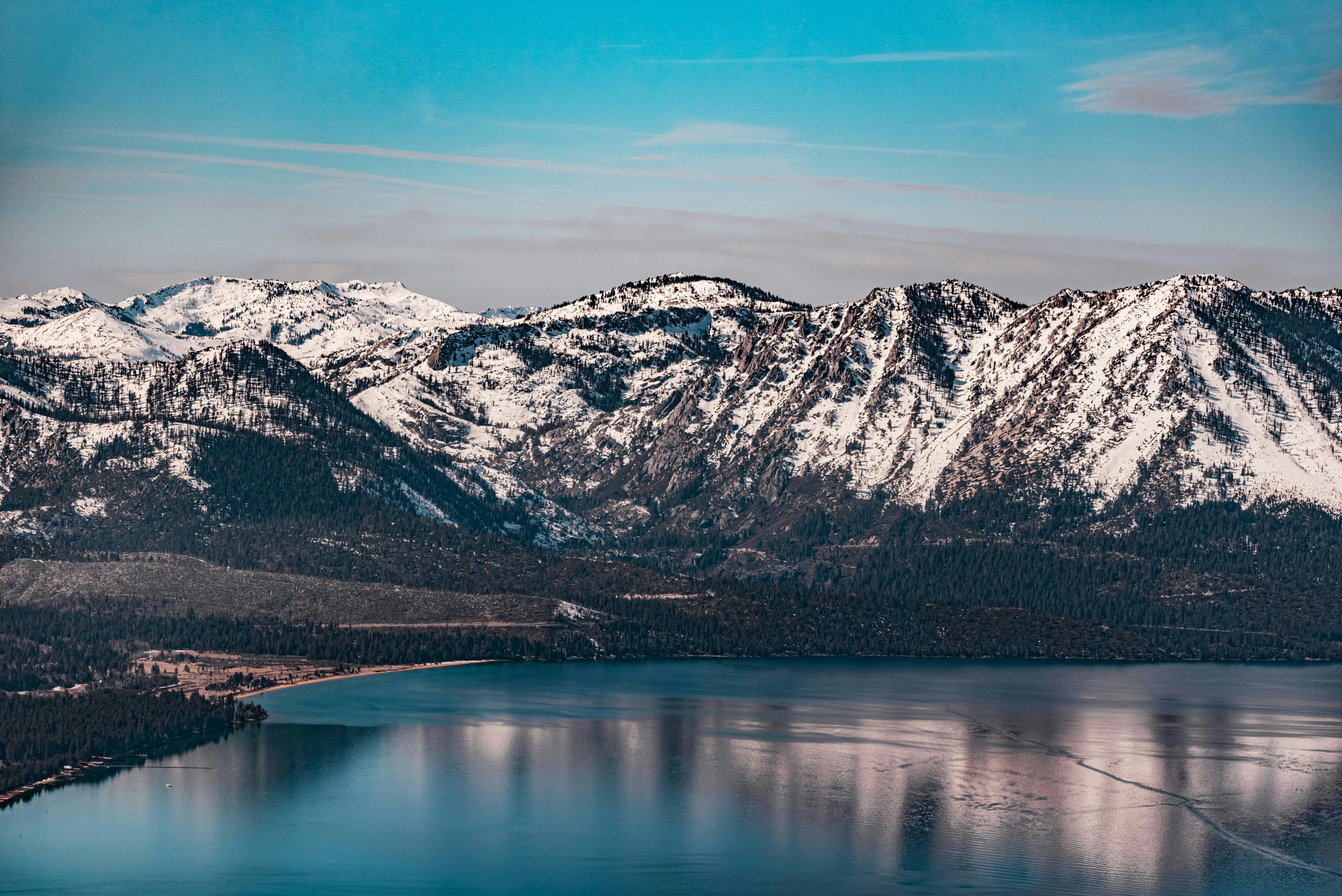 Snow Covered Mountain Near Lake · Free Stock Photo