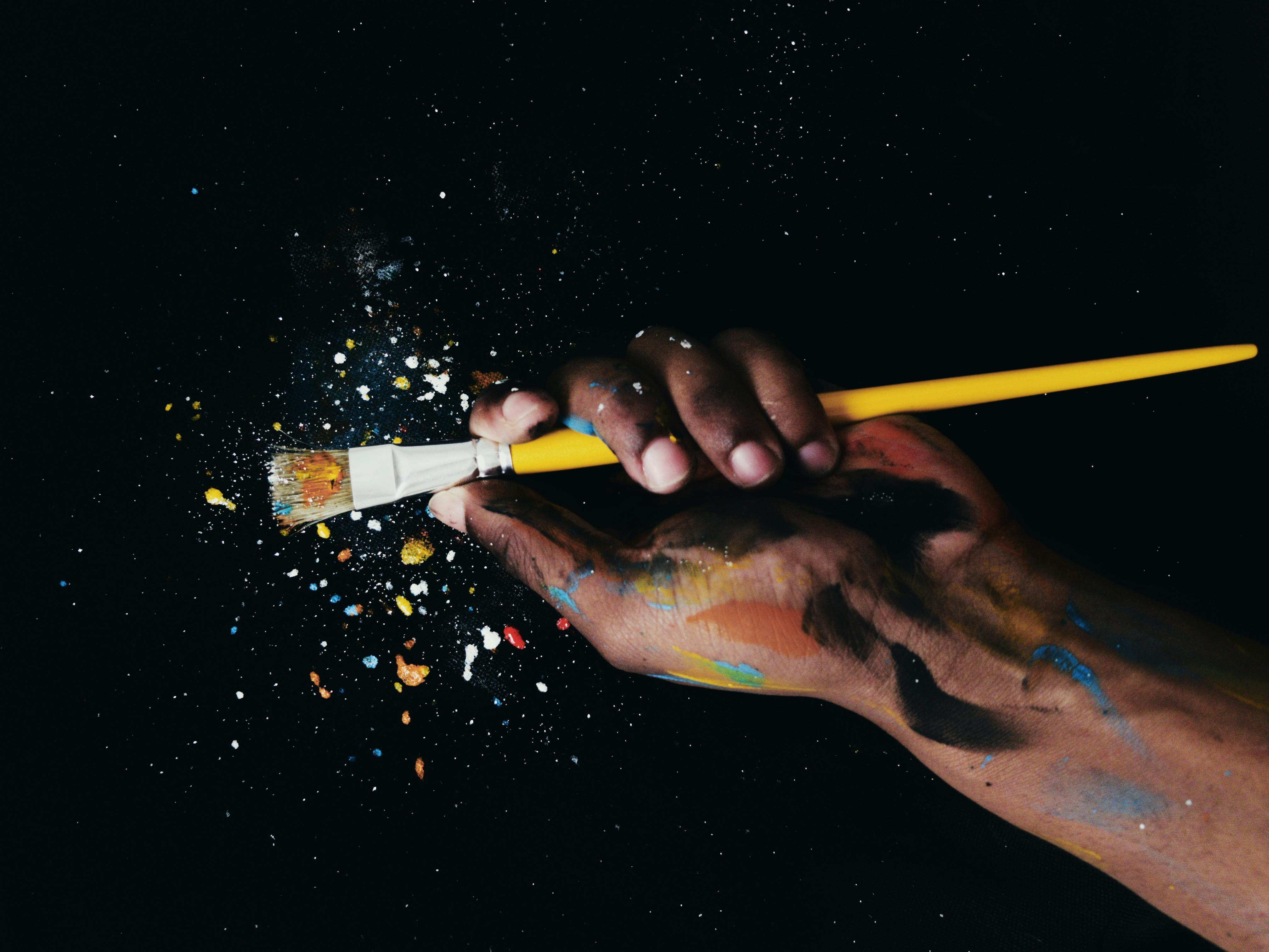 Hands Holding Paintbrush · Free Stock Photo