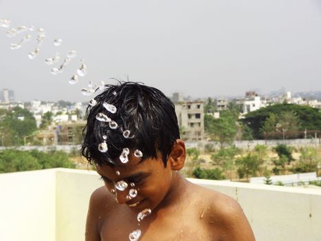 Free stock photo of water-droplets-falling-on-boy.jpeg