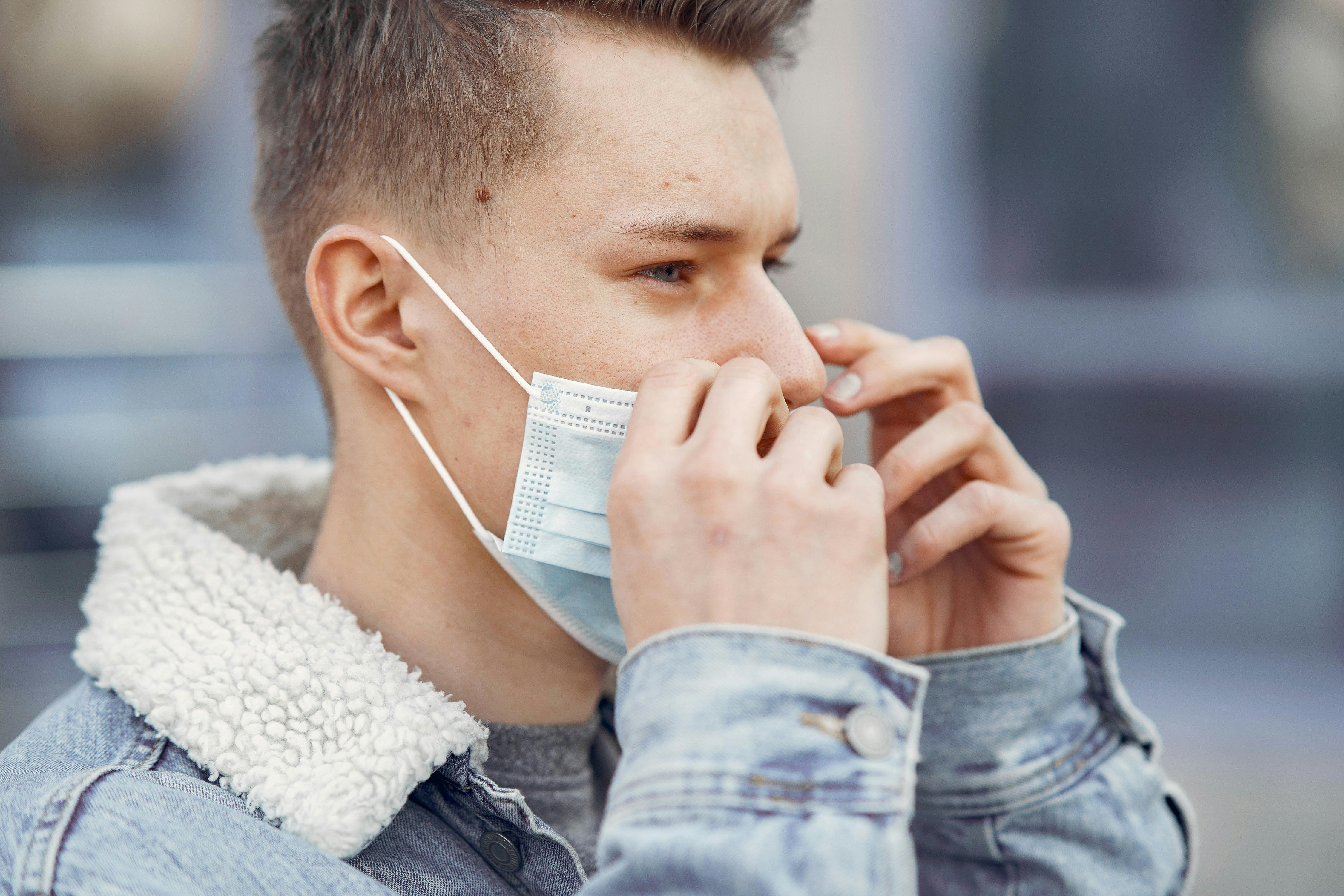 Man in Blue Denim Jacket Covering Her Face With Face Mask · Free Stock ...