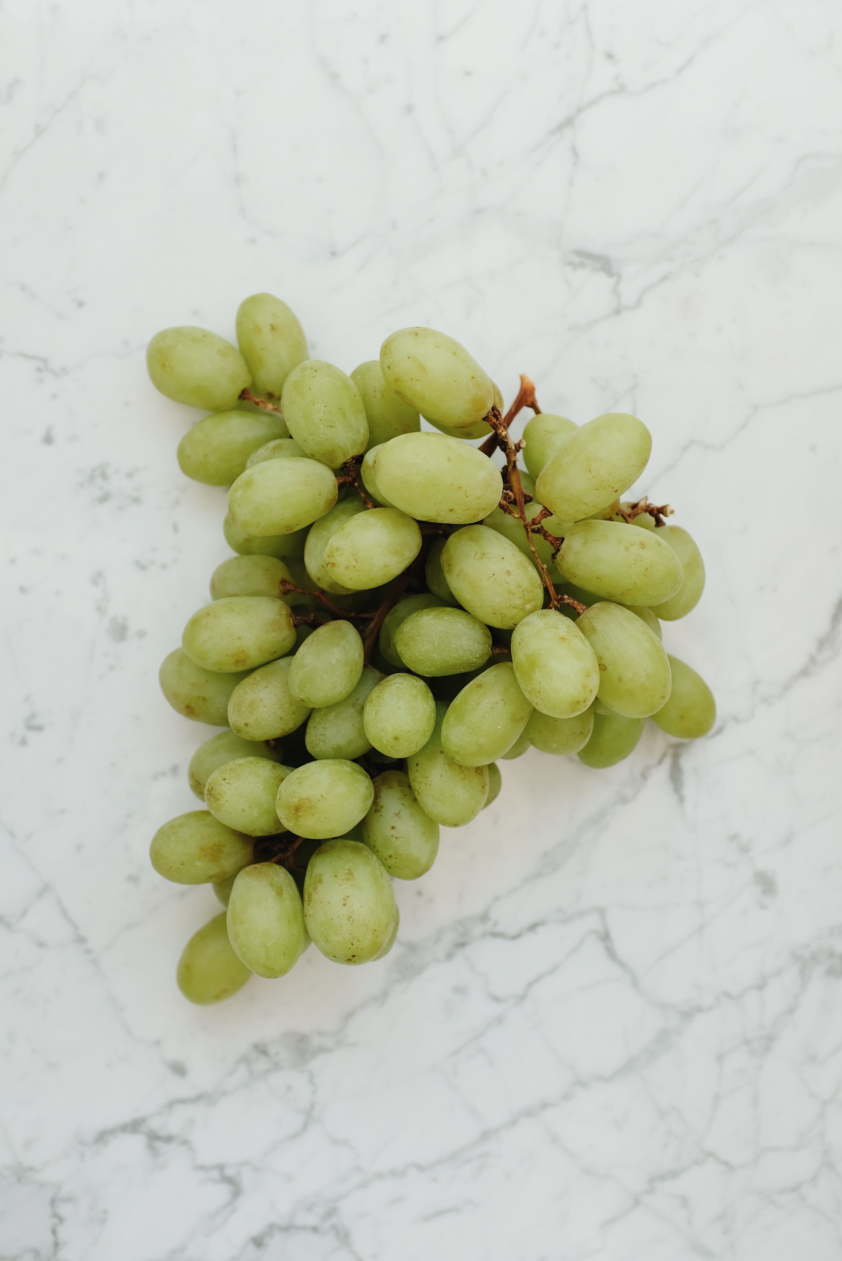 Green Grapes on Marble Table · Free Stock Photo