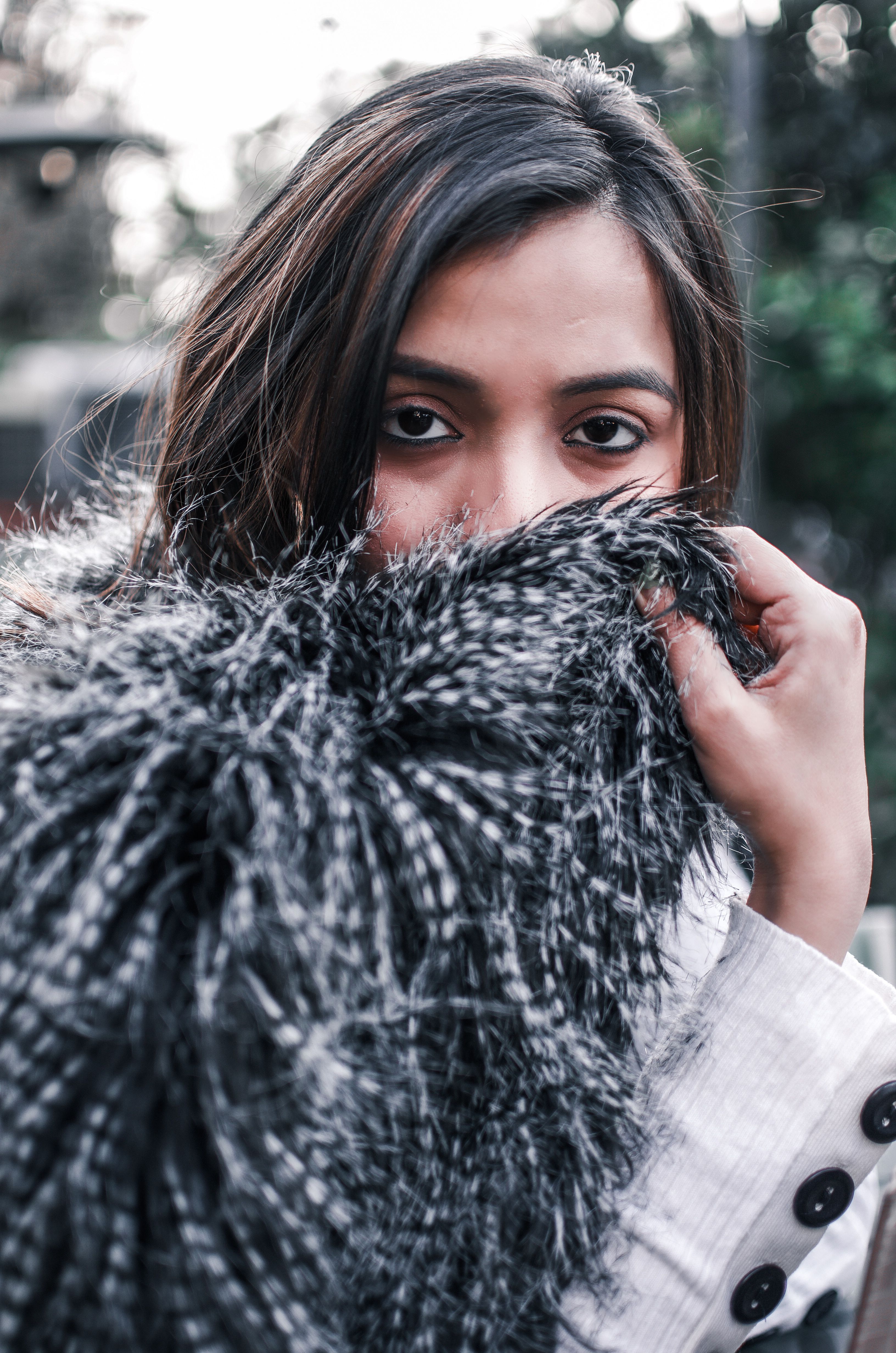 Woman Covering Face With Fur Coat · Free Stock Photo