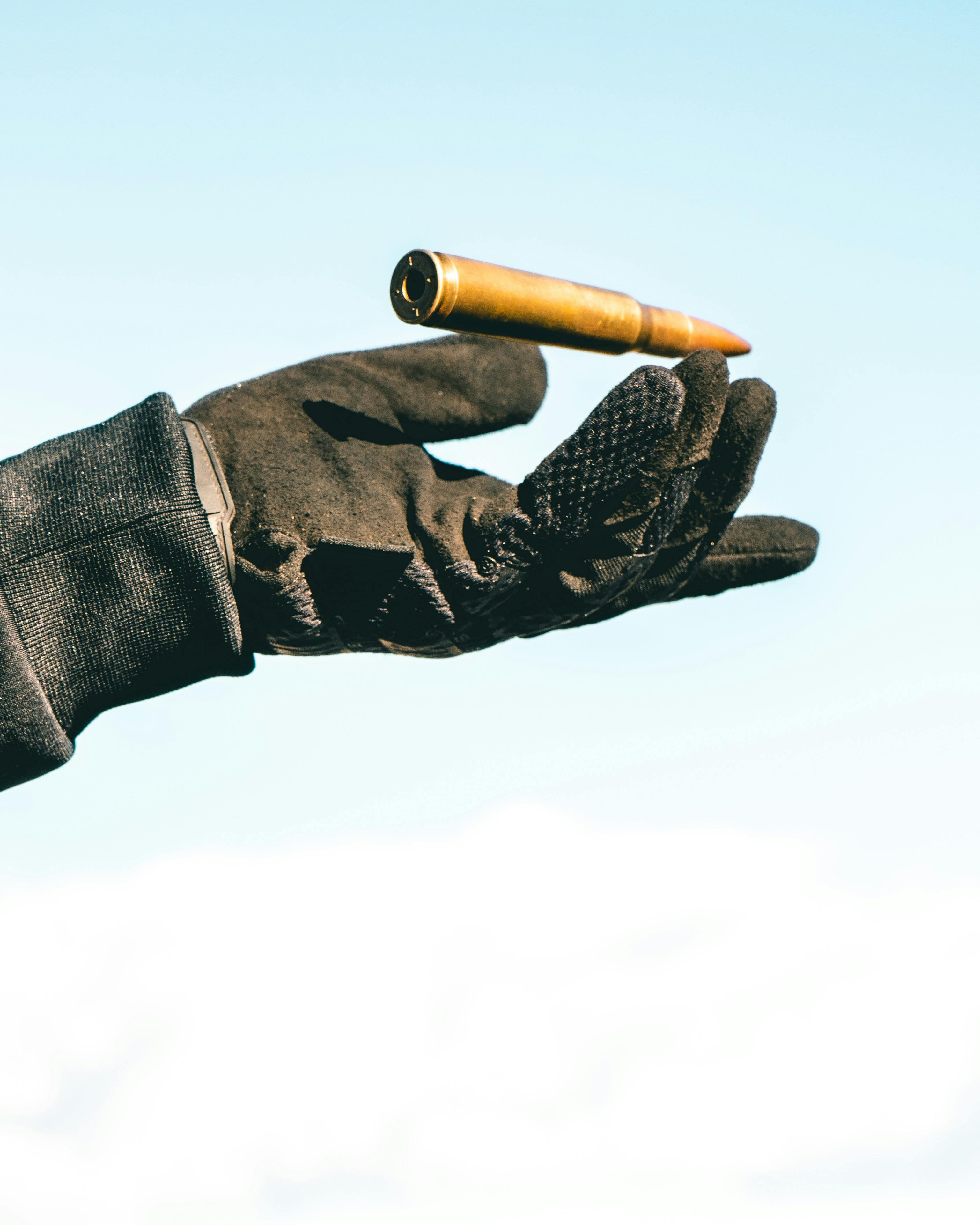 Crop man with cartridge on hand · Free Stock Photo