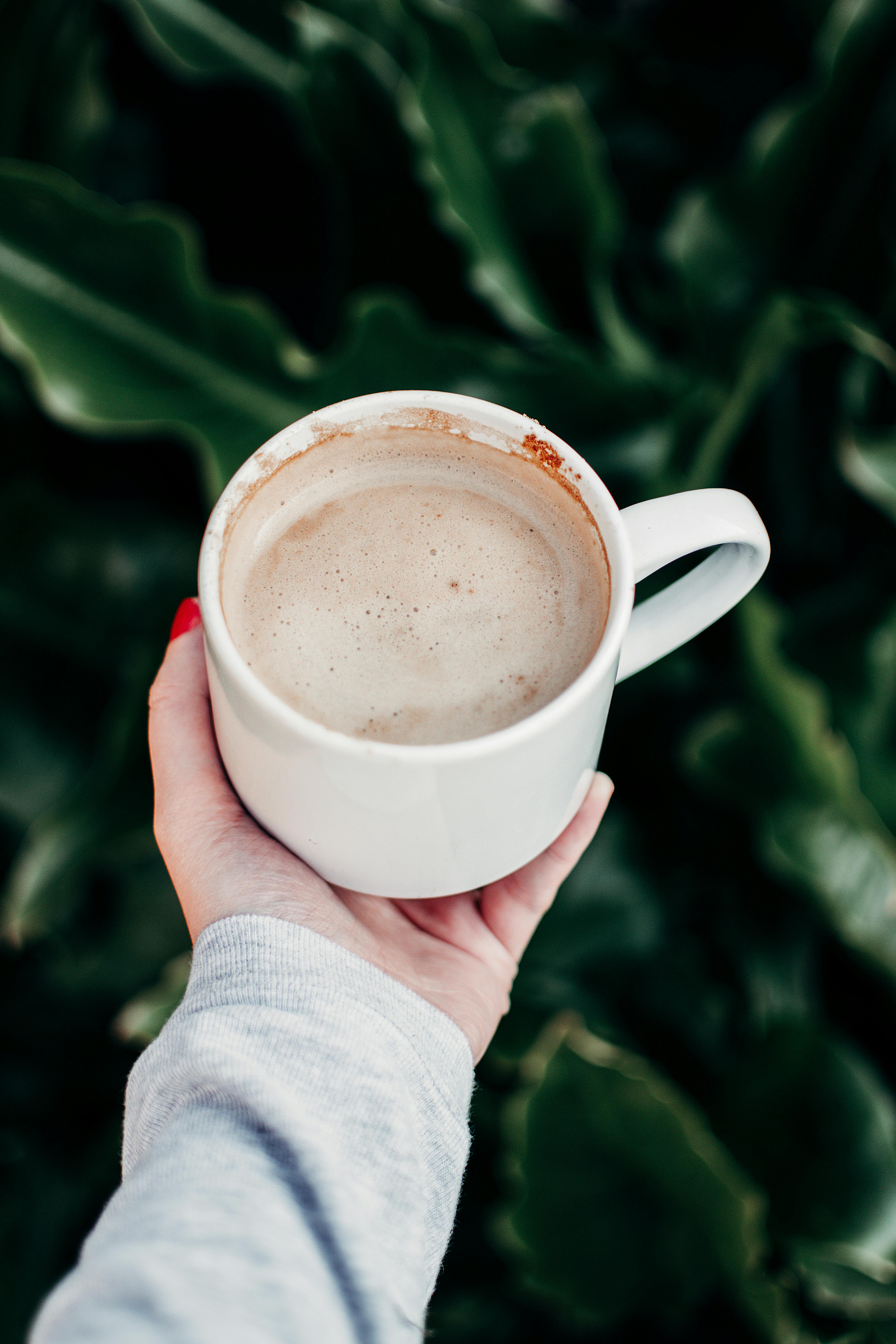 Person Holding White Ceramic Mug With Brown Liquid · Free Stock Photo