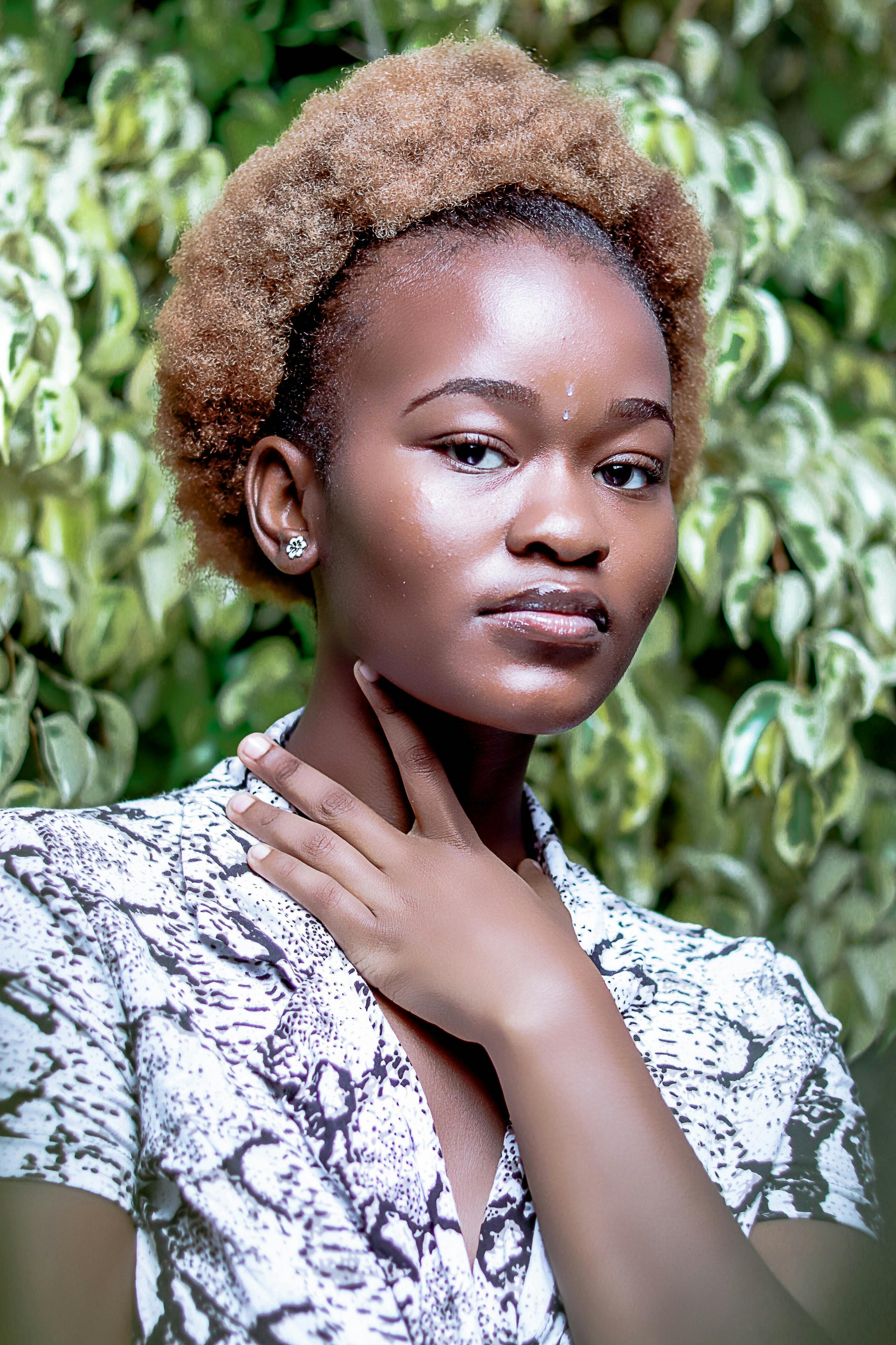 Beautiful ethnic female model in garden · Free Stock Photo