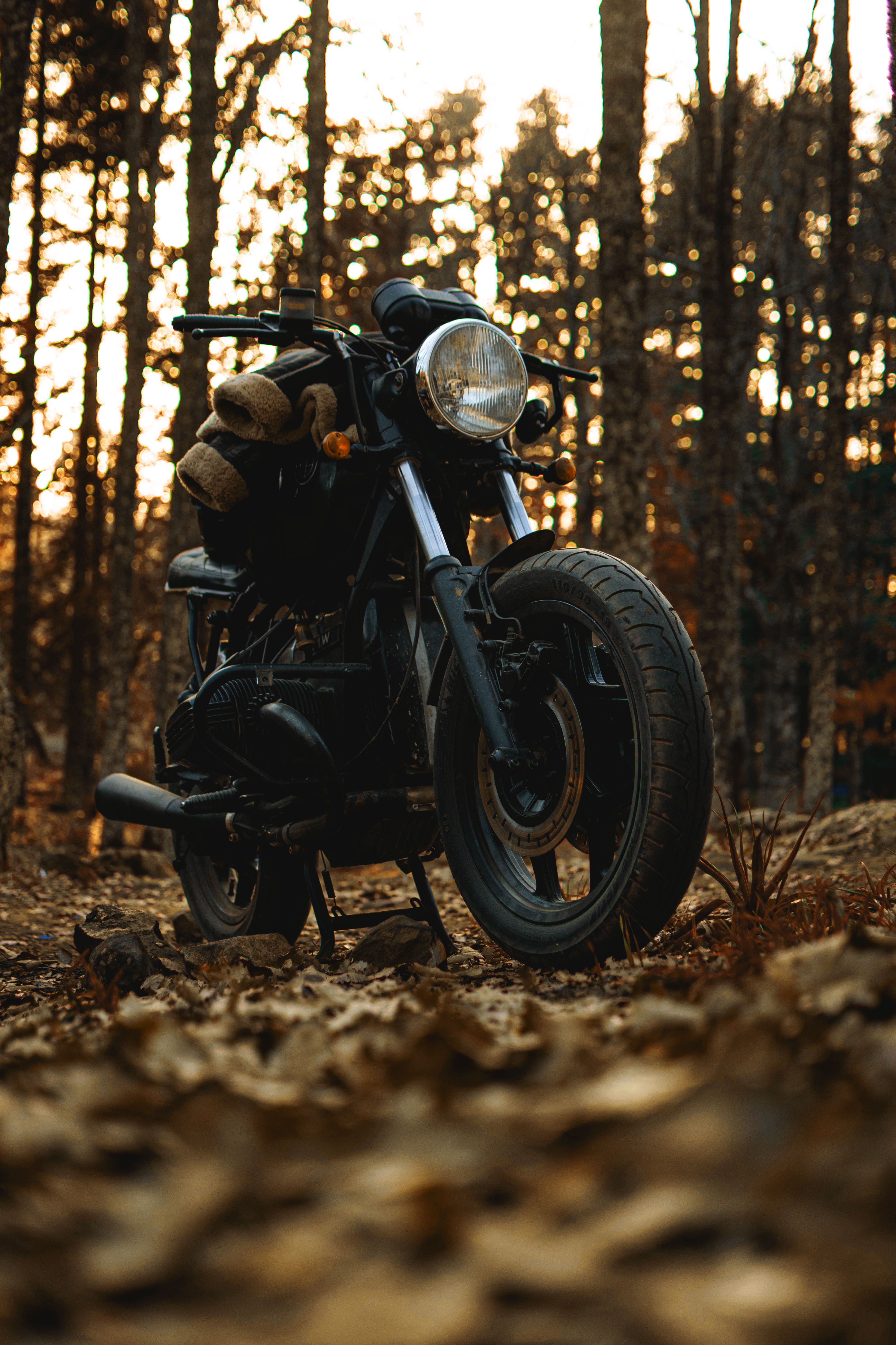 A Low Angle Shot of a Motorcycle Parked on the Street · Free Stock Photo